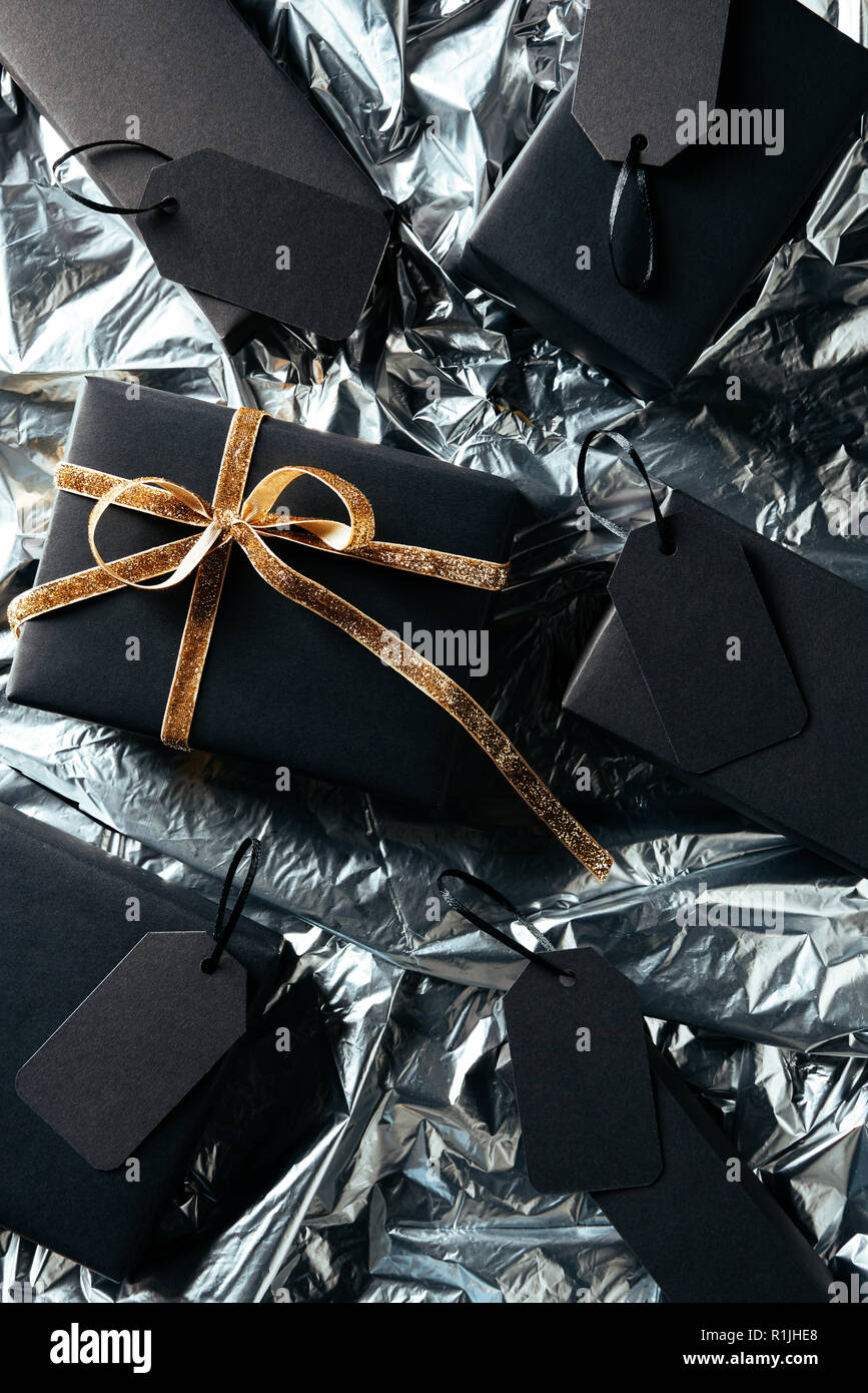 flat lay with arranged gift, boxes and blank price tags on silver ...