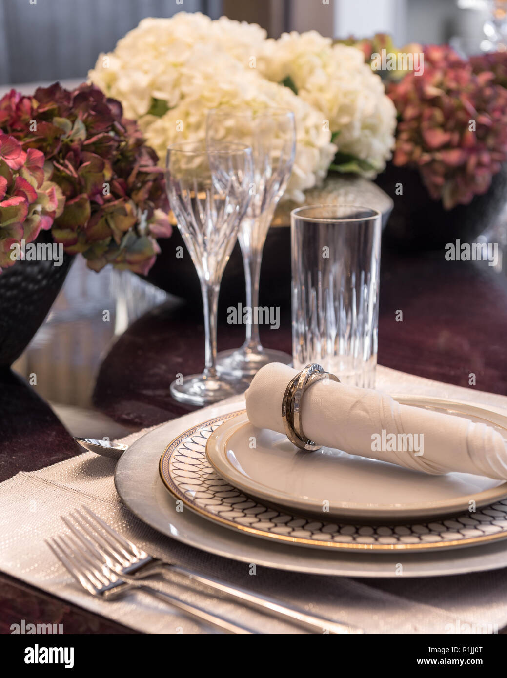 Place setting by flowers Stock Photo - Alamy