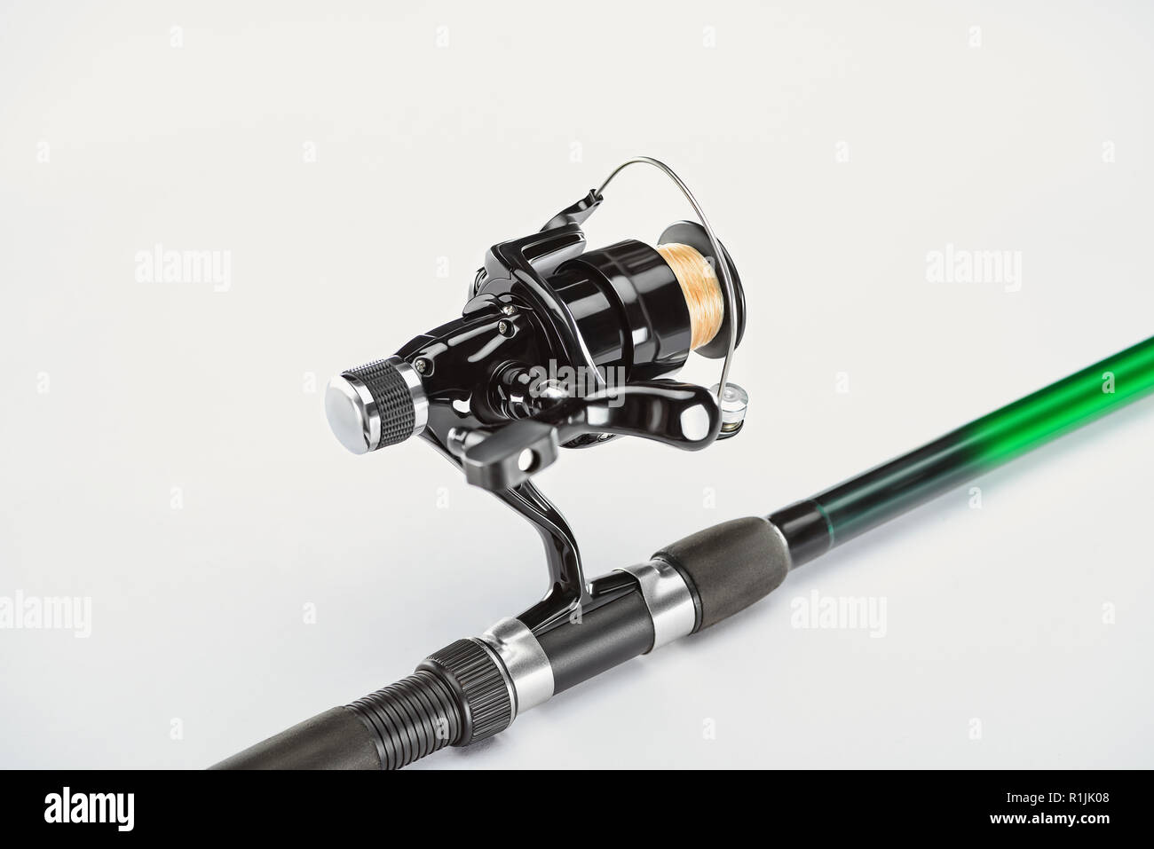 close up view of fishing rod isolated on white, minimalistic concept ...