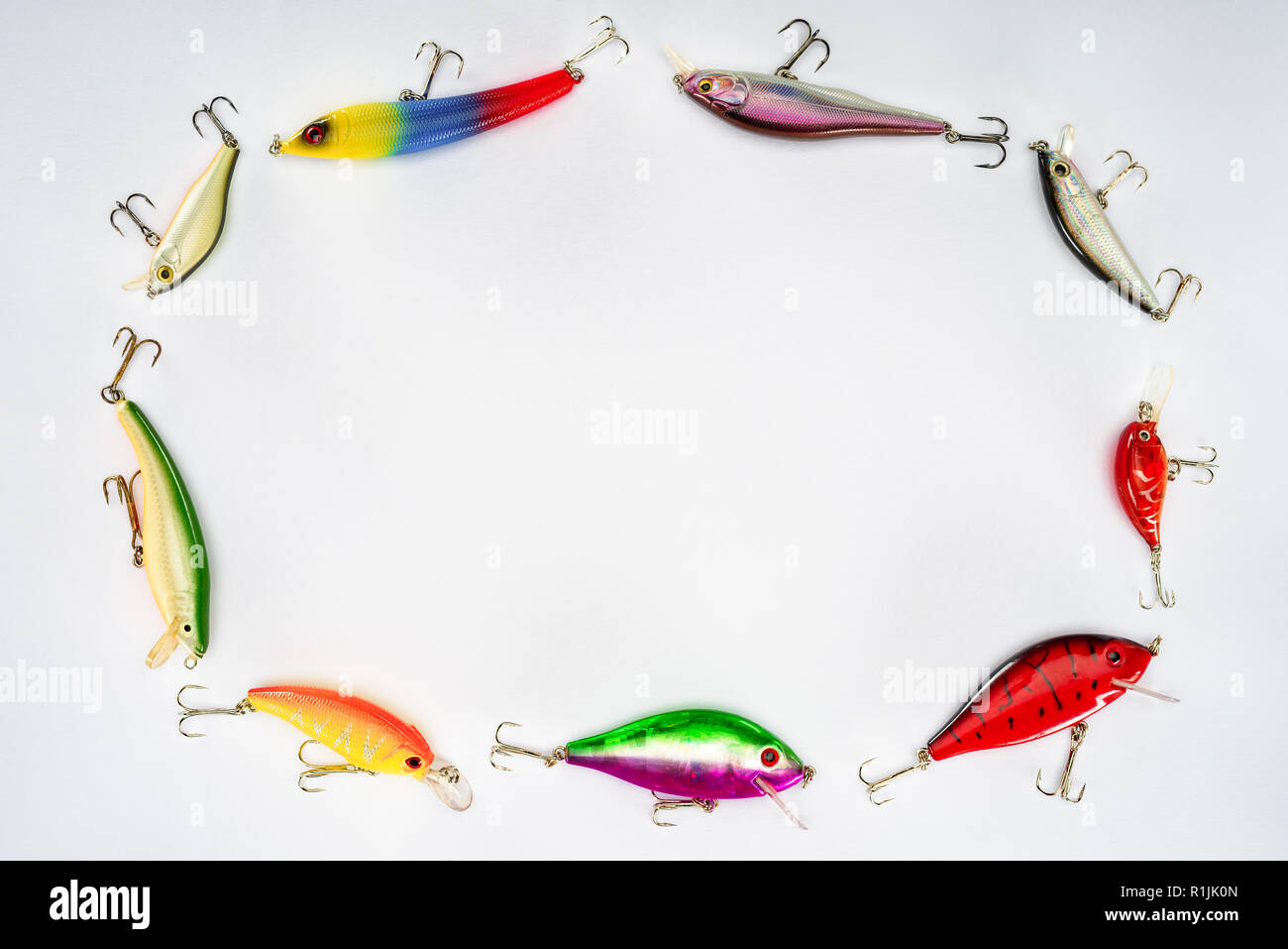 top view of circle made of various fishing bait isolated on white ...