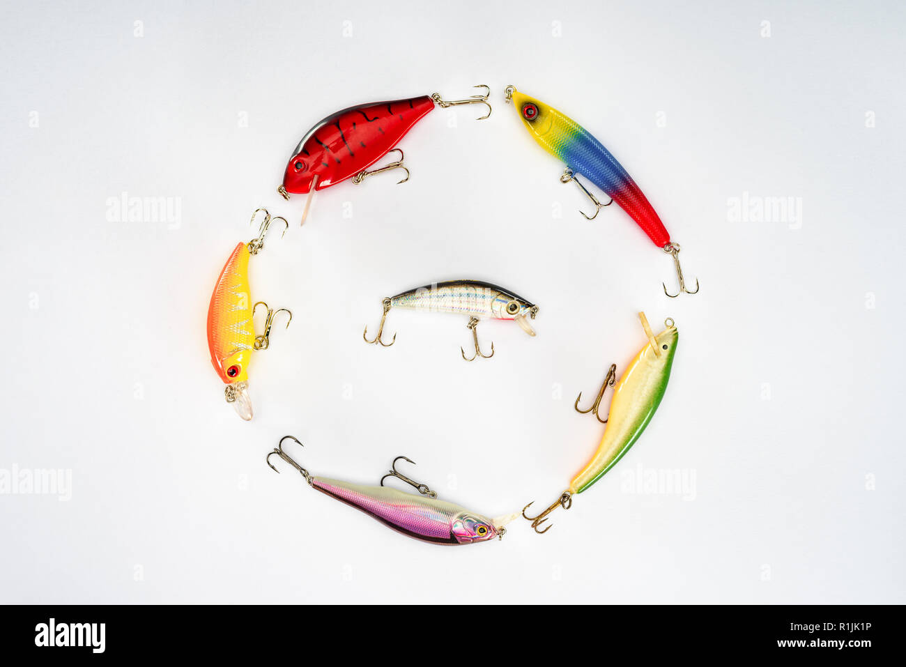 flat lay with circle made of various fishing bait isolated on white ...