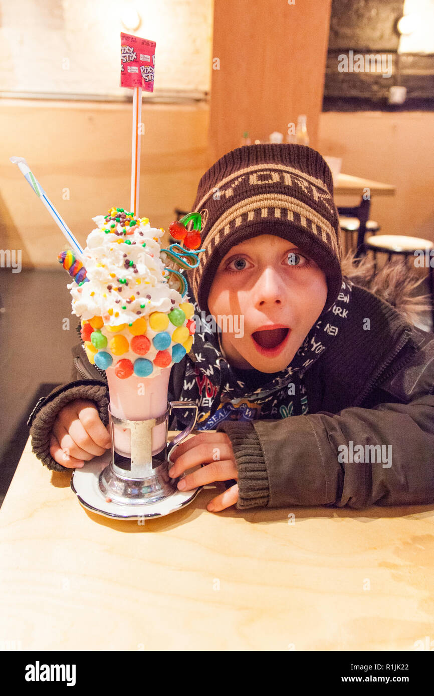 Nine year old boy with a Sour Power black cherry Crazy Shake milkshake ...