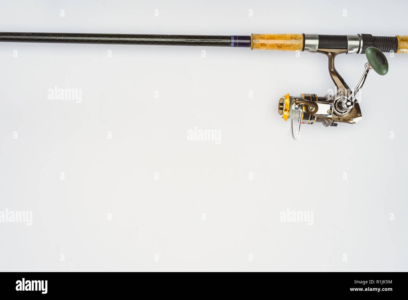 elevated view of fishing rod isolated on white, minimalistic concept ...