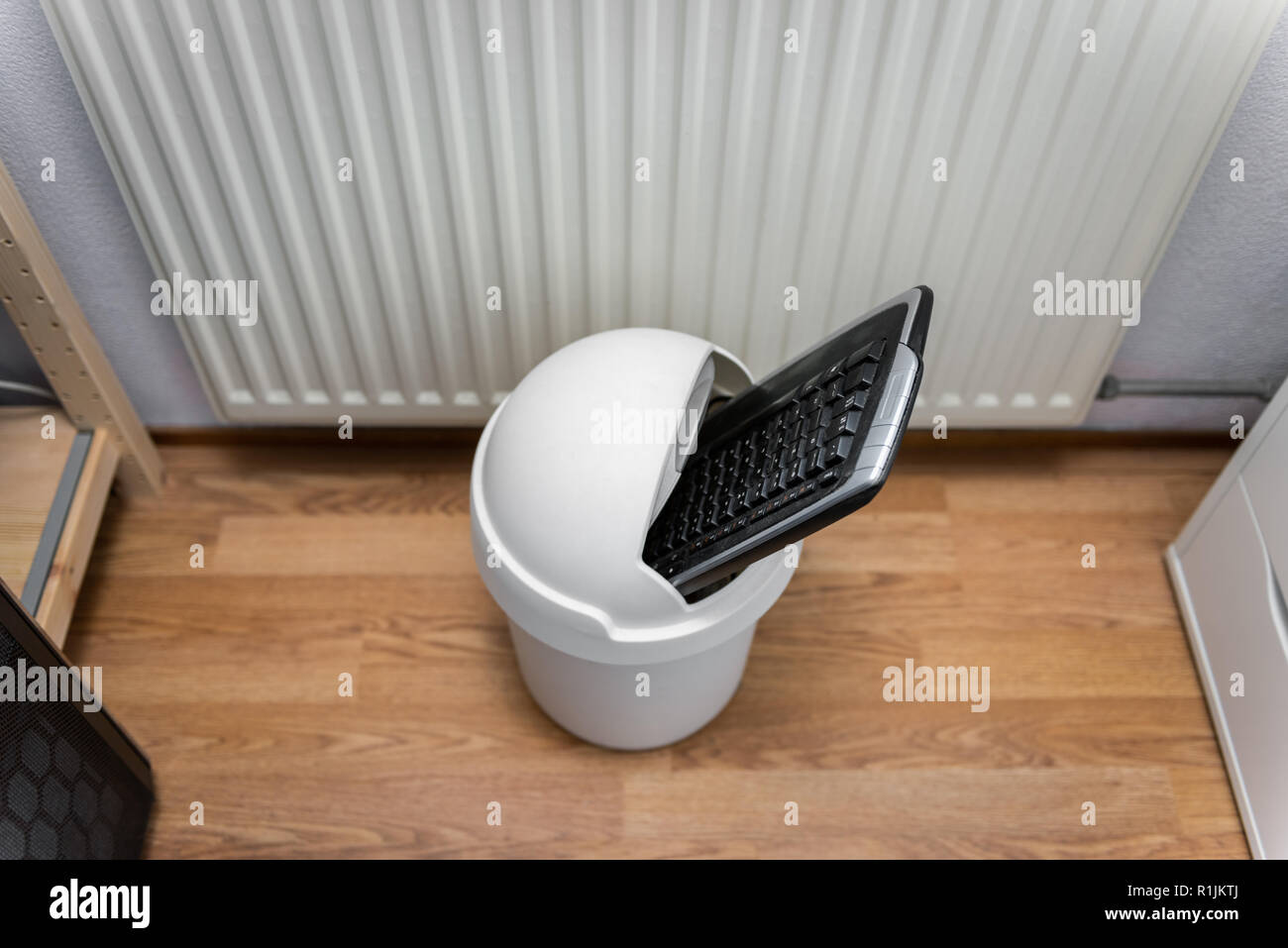 Computer Keyboard in Trash Can on Office Floor, looking down Stock ...
