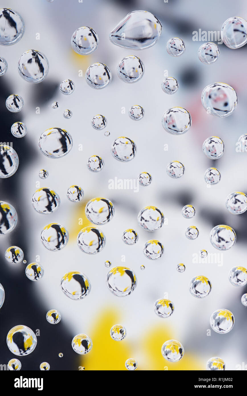 close-up view of beautiful clean dew drops on blurred abstract ...
