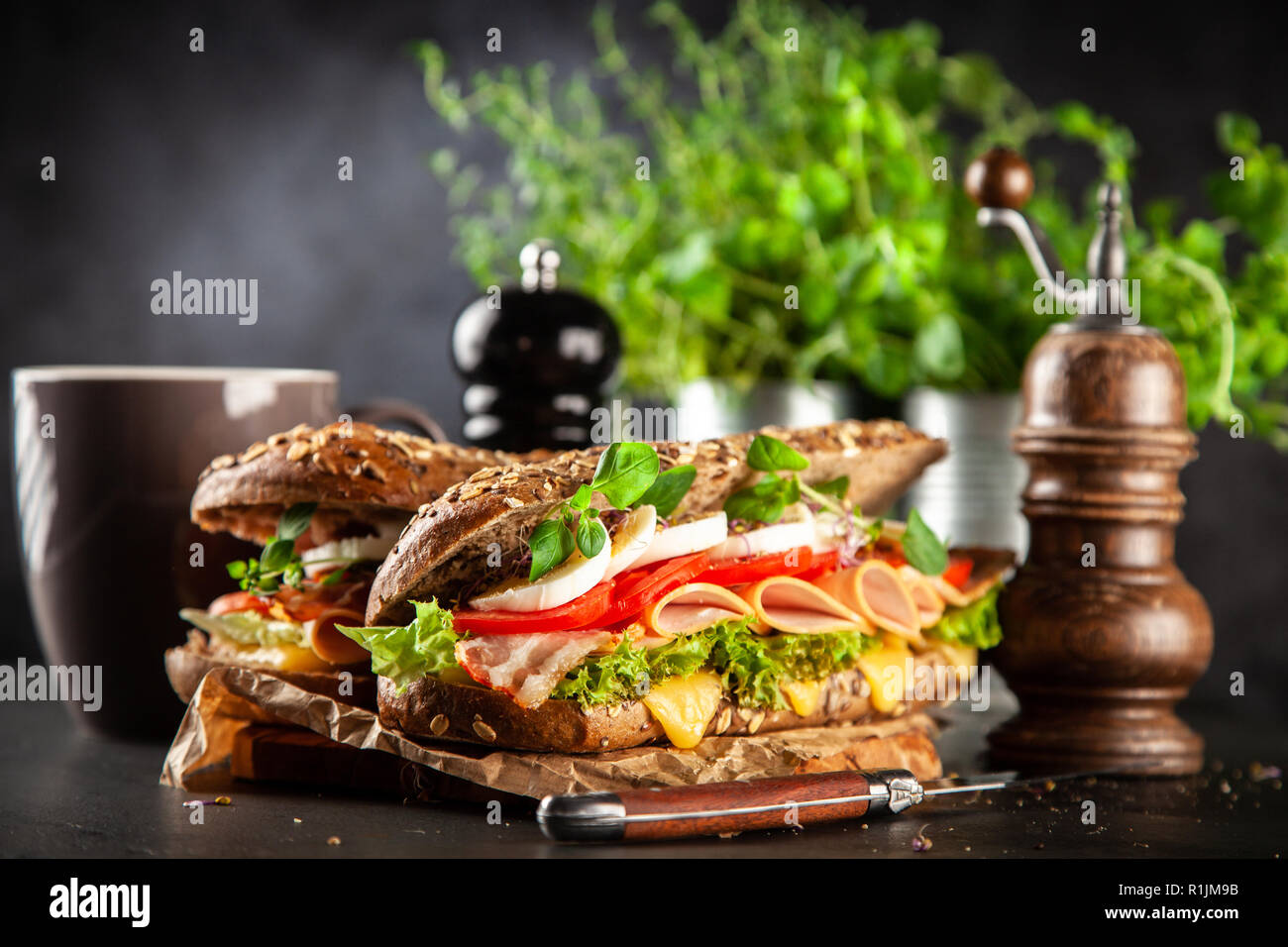 Classic BLT sandwiches on dark background Stock Photo - Alamy