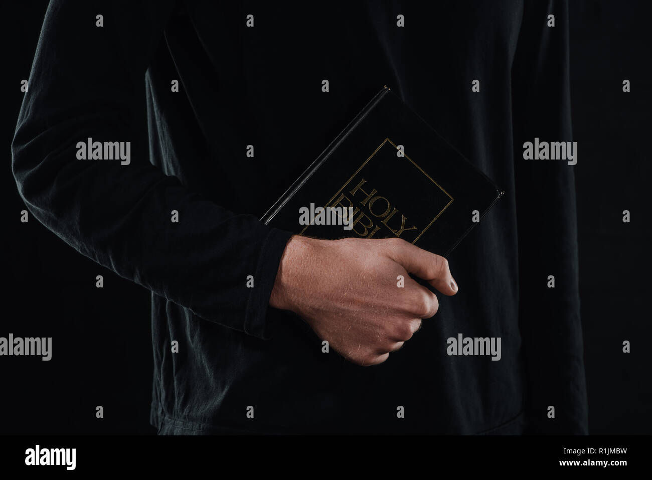 Catholic priest holding bible hi-res stock photography and images - Alamy