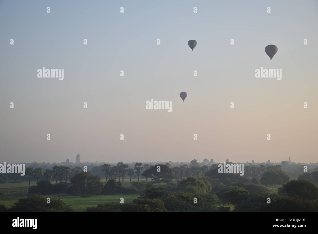 Hot air balloons flying over Bagan archaeological area at sunrise ...