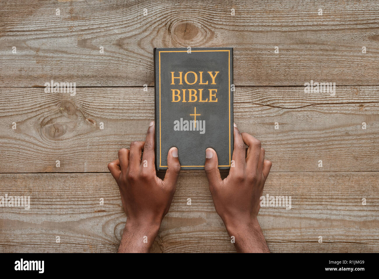 Man holding up bible hi-res stock photography and images - Alamy