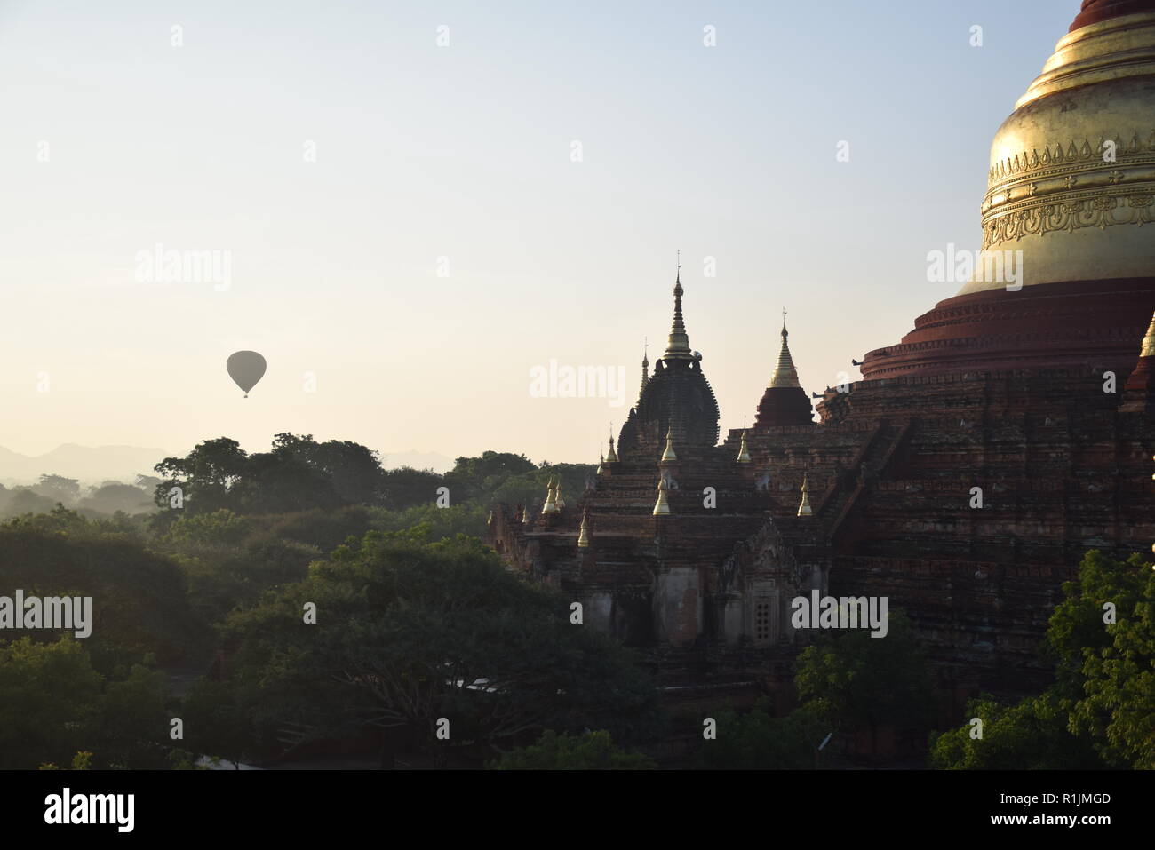 Hot air balloons flying over Bagan archaeological area at sunrise ...