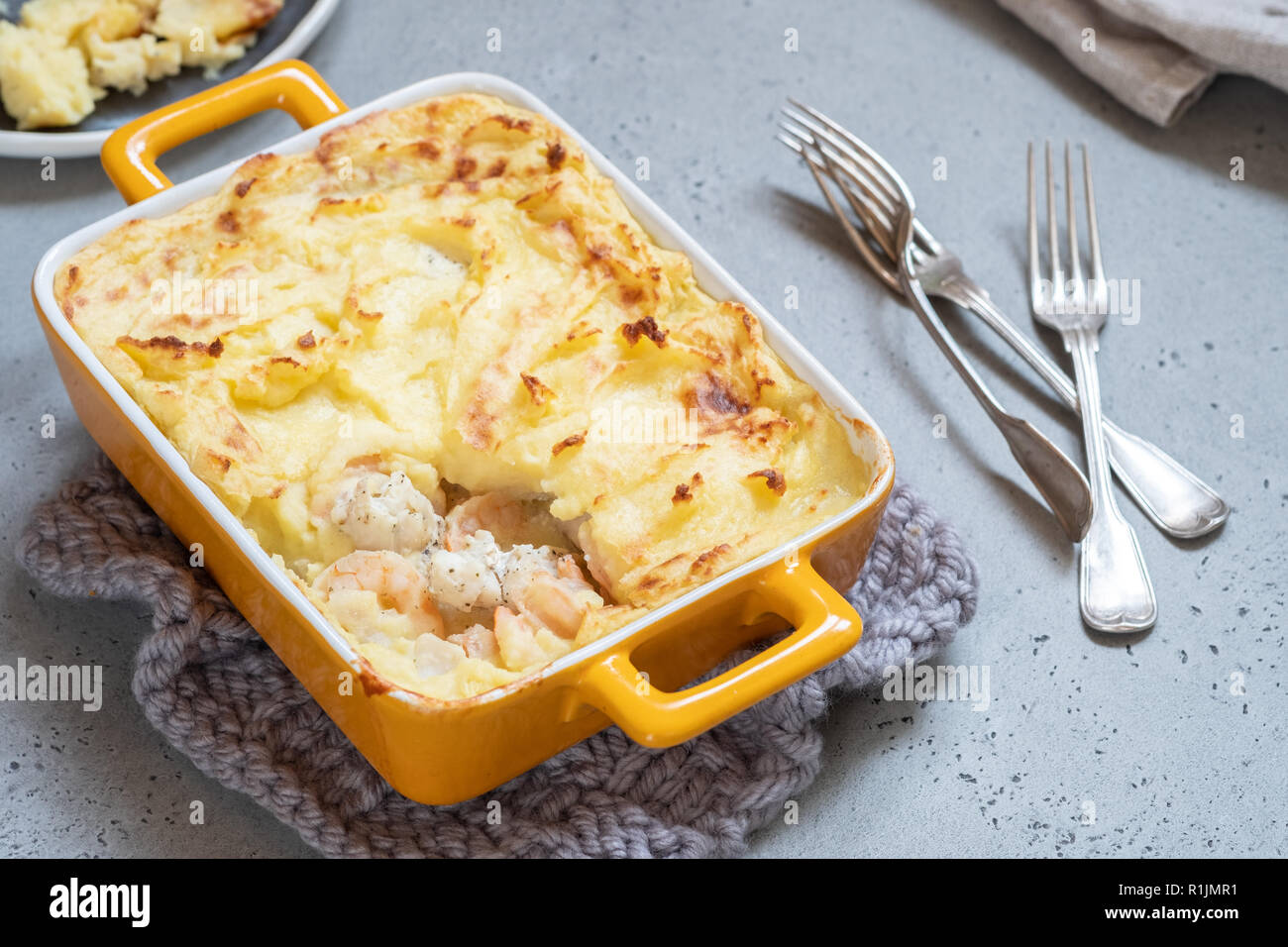 Fish pie with shrimp topped with mashed potato Stock Photo - Alamy