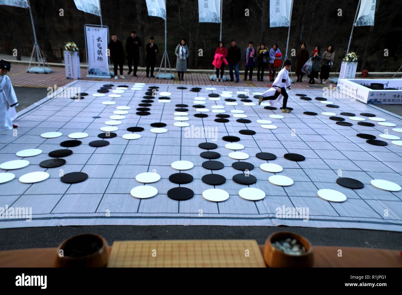 China. 13th Nov, 2018. Luoyang, CHINA-People play a special go chess ...