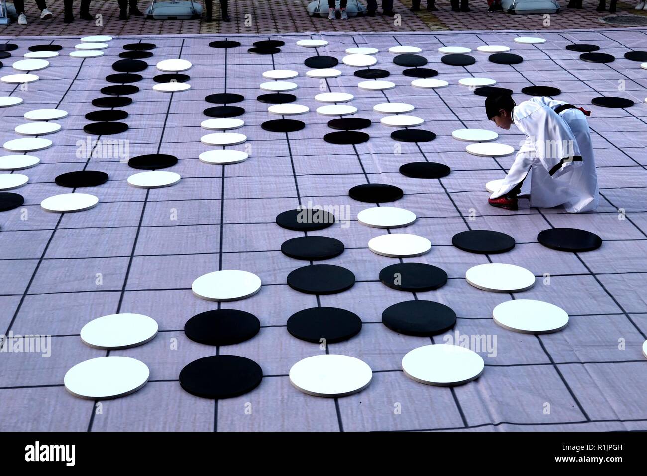 China. 13th Nov, 2018. Luoyang, CHINA-People play a special go chess ...