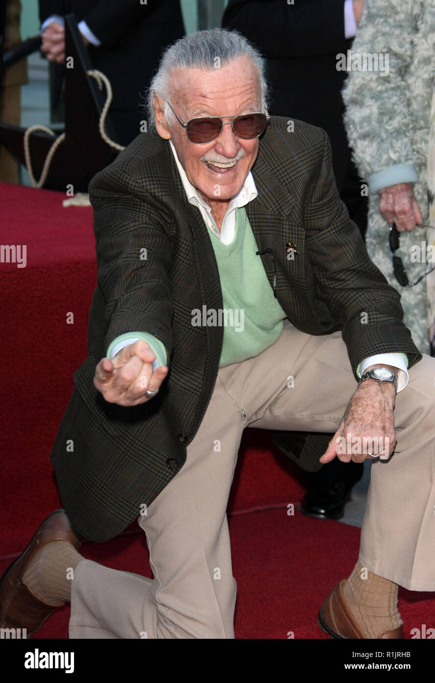 US artist and comic book creator Stan Lee strikes a Spider-Man pose ...