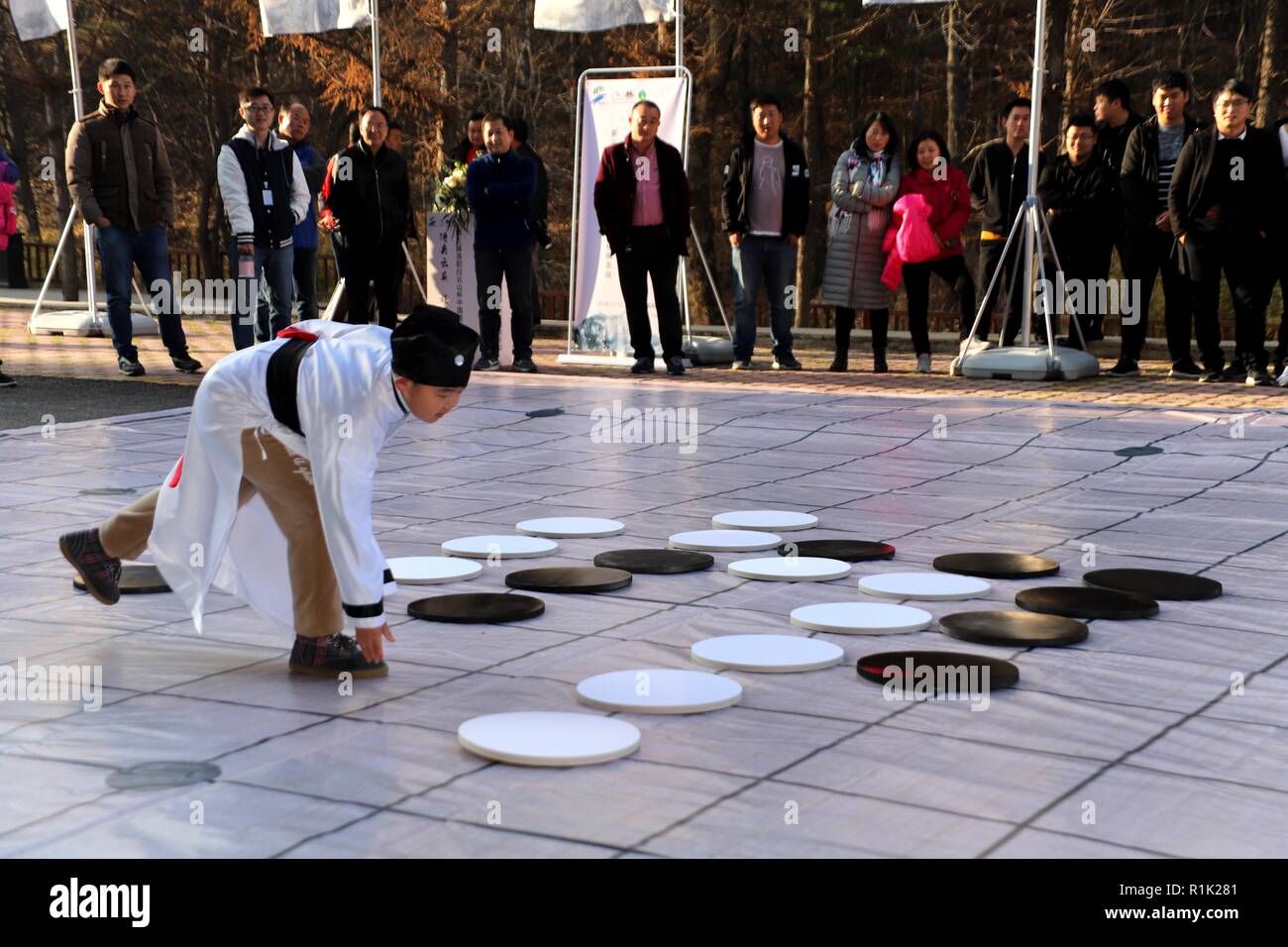 Luoyang, China. 13th Nov, 2018. People play a special go chess contest ...