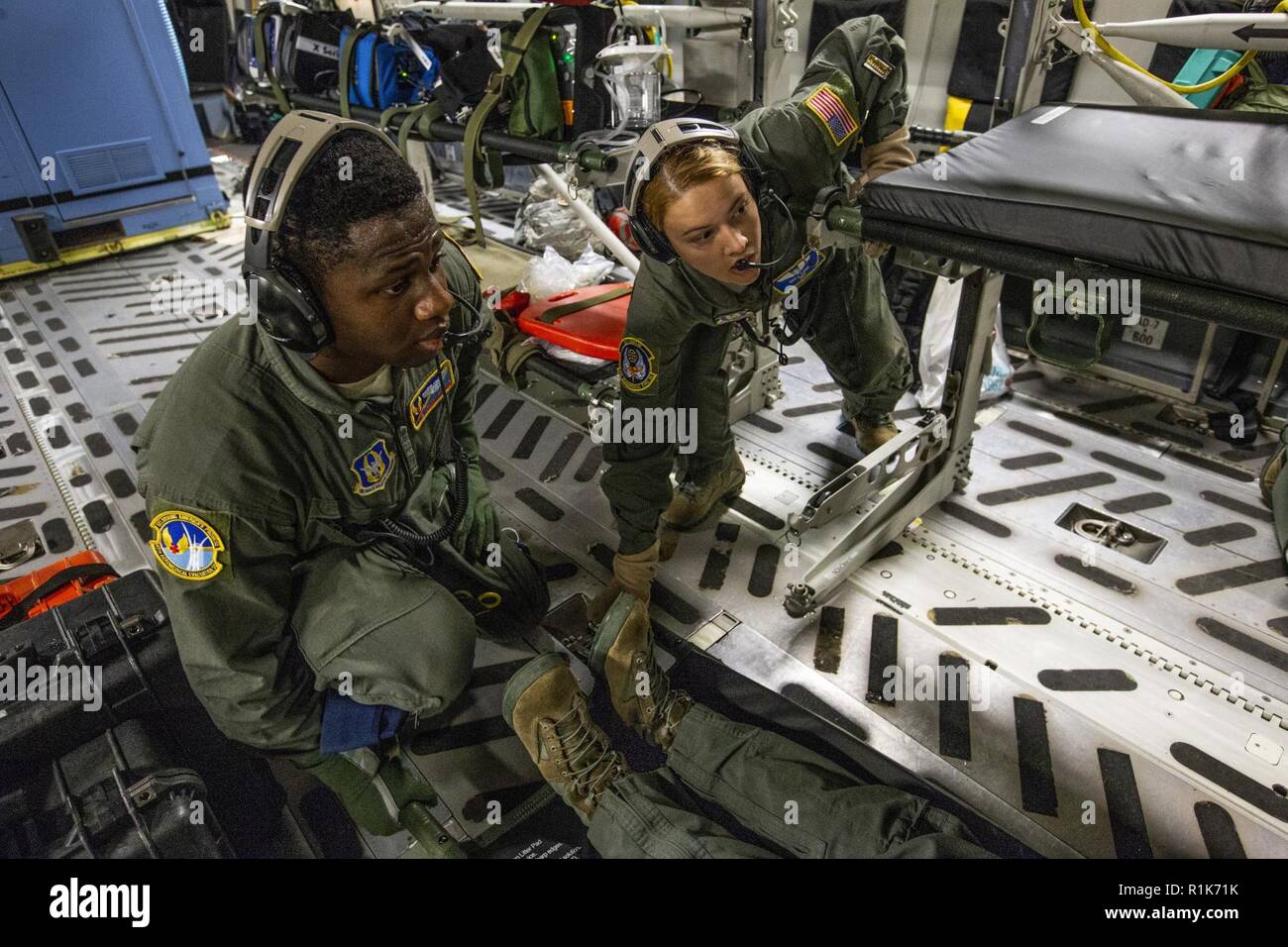 U.S. Air Force Senior Airman Darius L. Wilson, left, an aeromedical ...