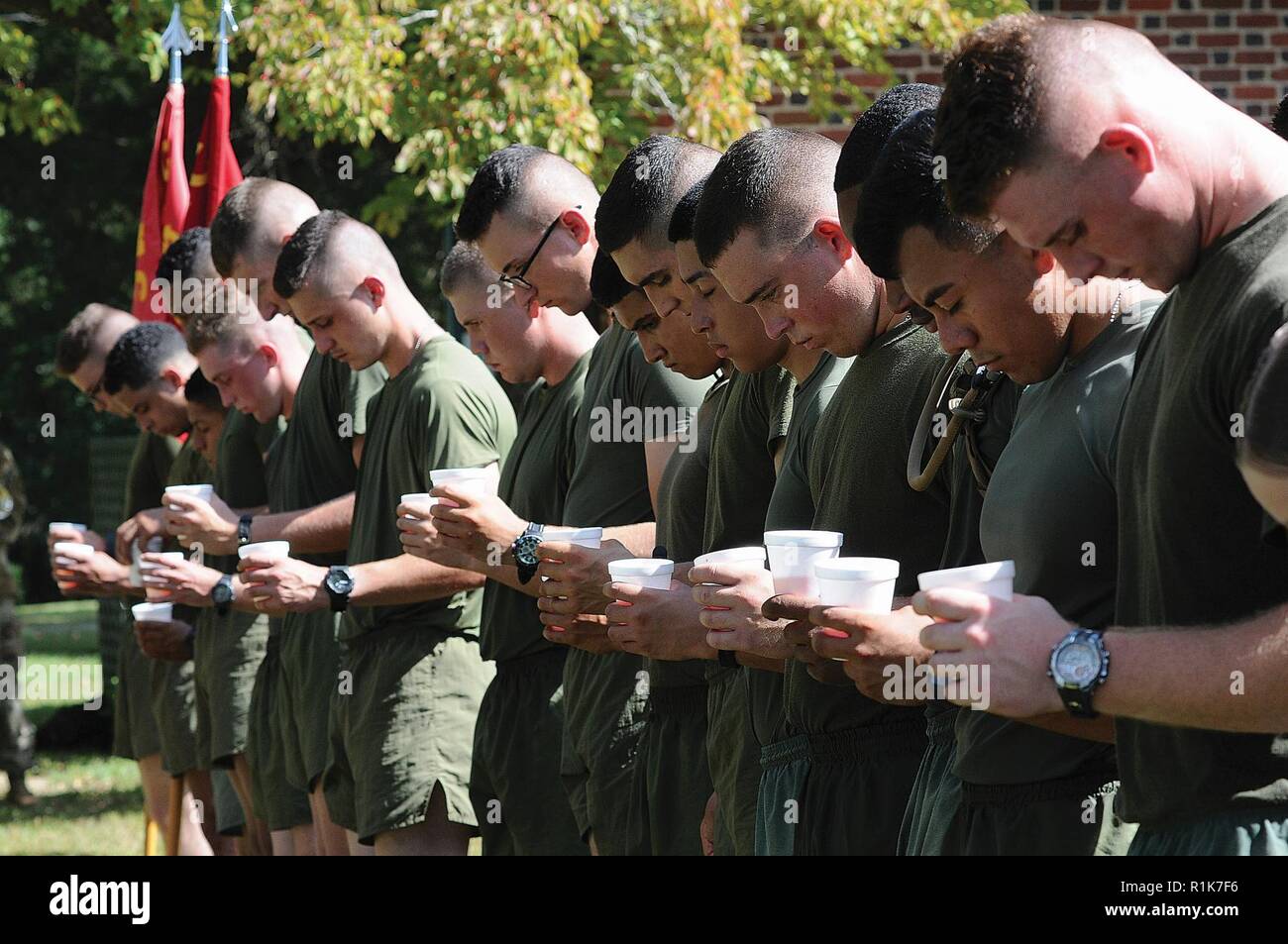 Marines bow their heads in prayer at the gravesite of Ret. Lt. Gen ...