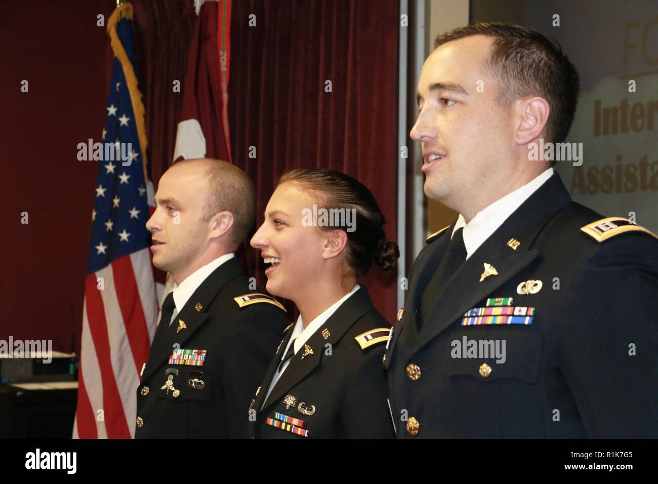 1st Lt. Chad Boone, 1st Lt. Ellen Broz and Capt. Nelson Liuzzo sing The ...