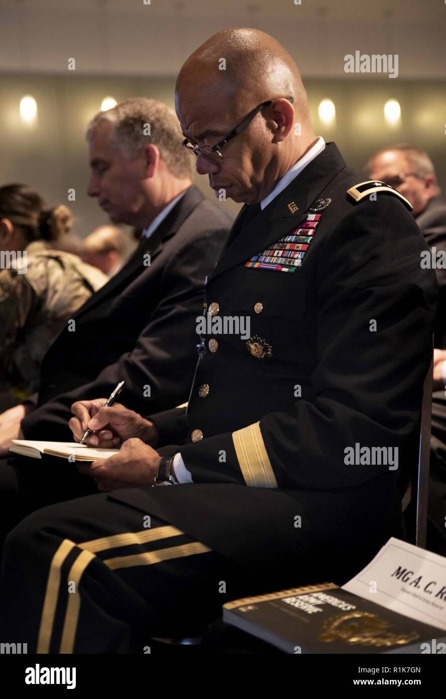 An audience member takes notes during a panel at the annual Association ...