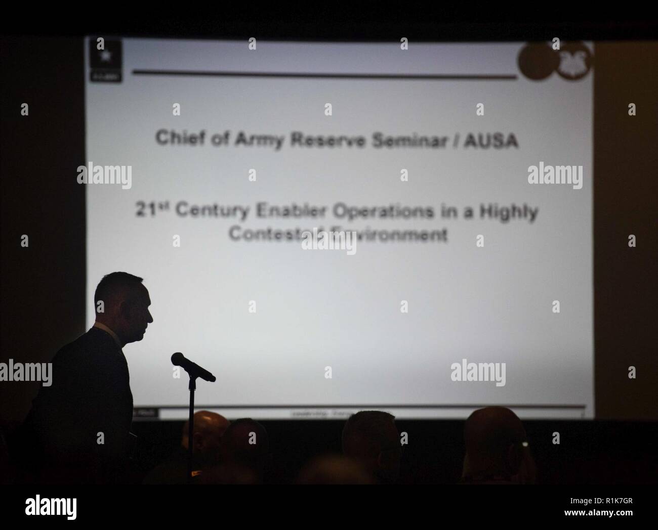 An audience member asks a question during a panel at the annual ...