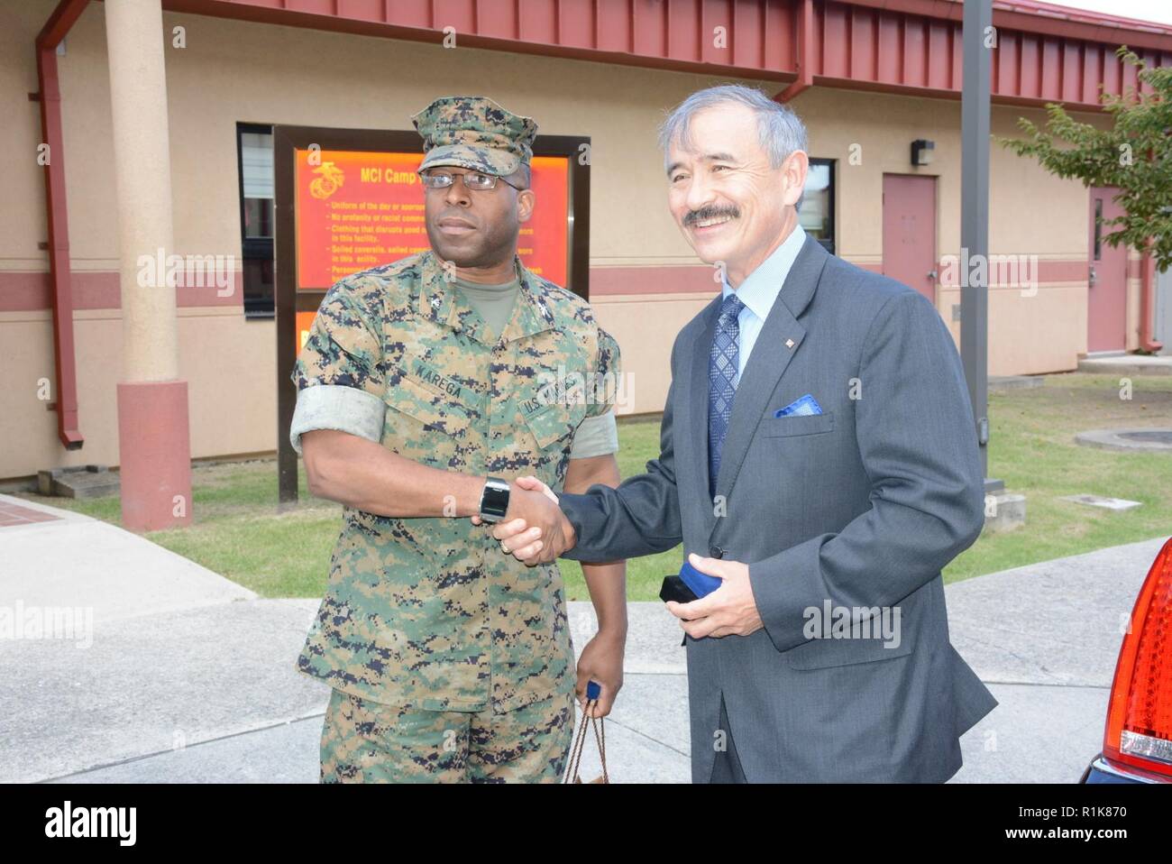 U.S. Marine Col. Sekou S. Karega, left, commanding officer of Camp ...
