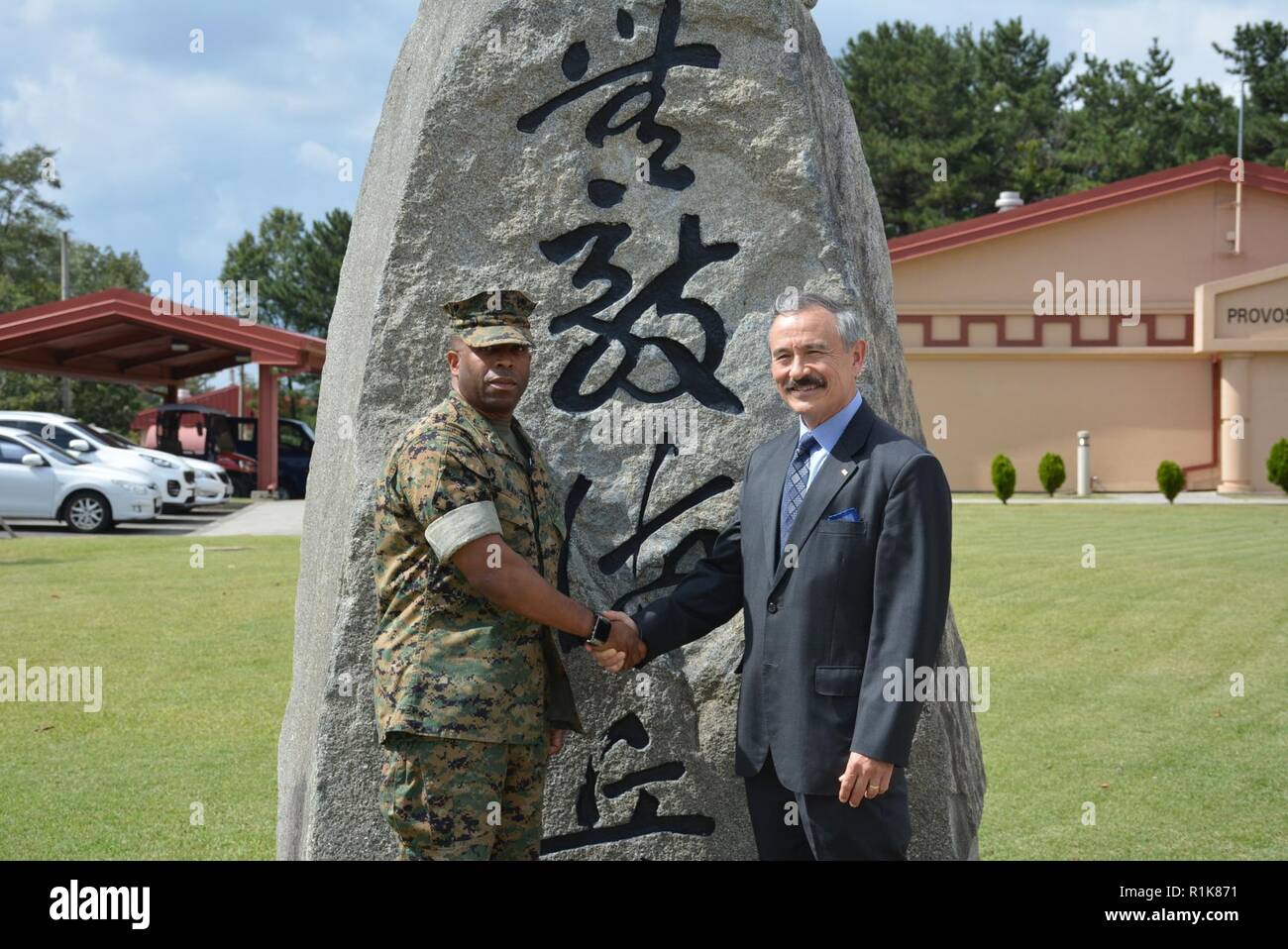 U.S. Marine Col. Sekou S. Karega, left, commanding officer of Camp ...
