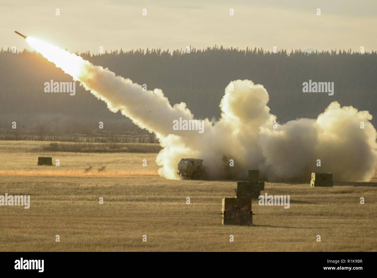 U.S. Soldiers assigned to the 18th Field Artillery Brigade fire an M142 ...