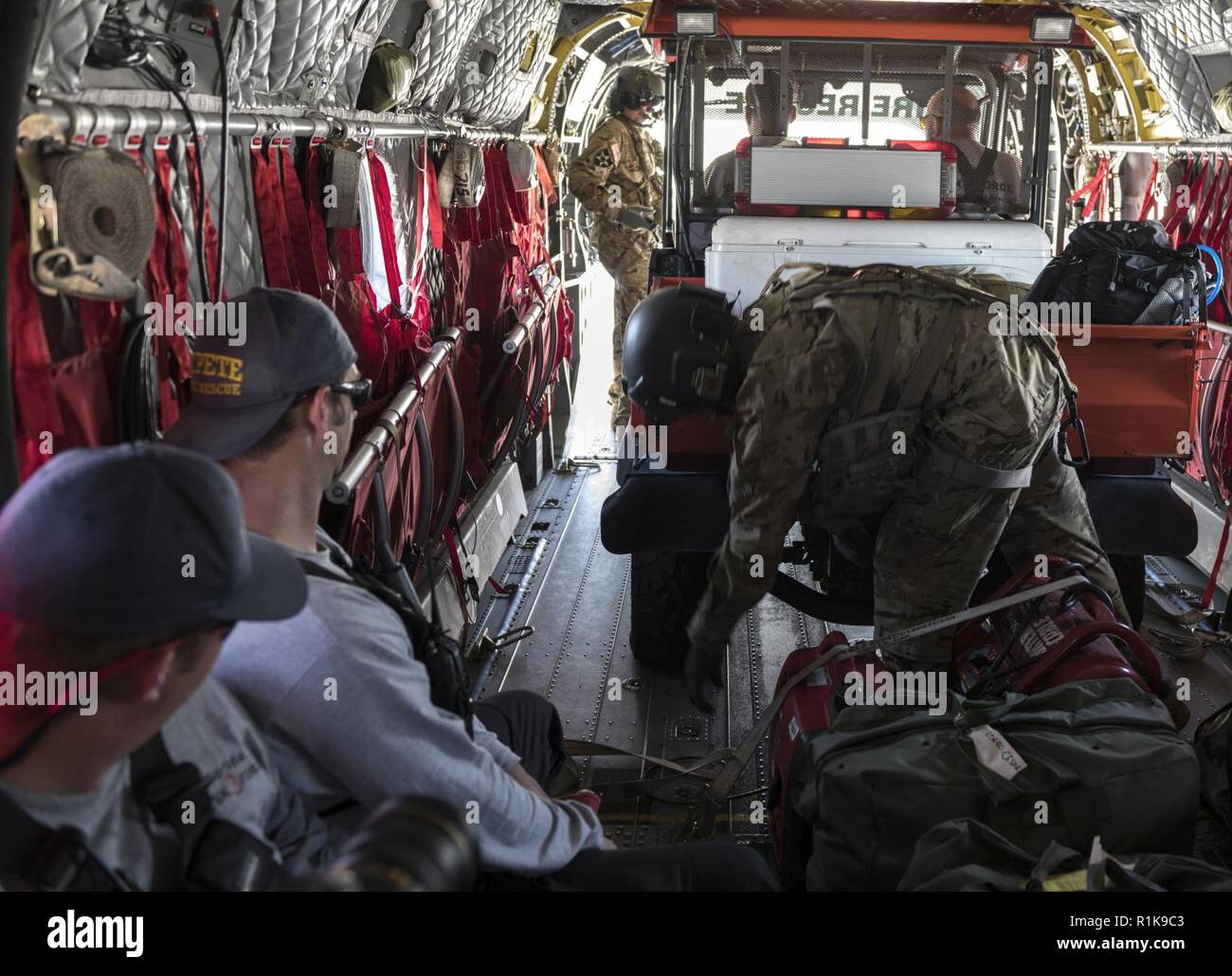 Members of Task Force Three, an urban search and rescue team, unload ...