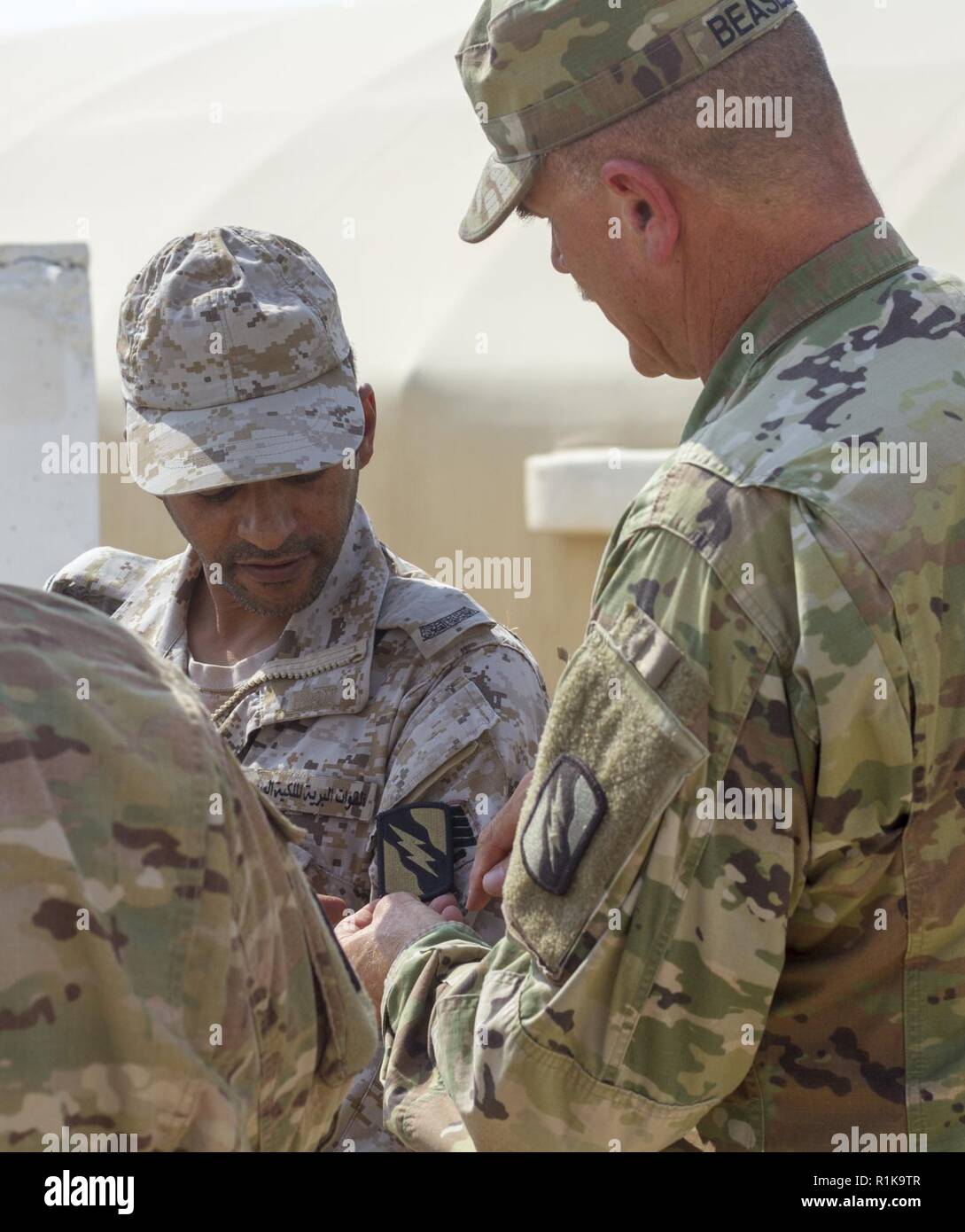 Soldiers of the Royal Saudi Land Forces receive mementos from the 155th ...