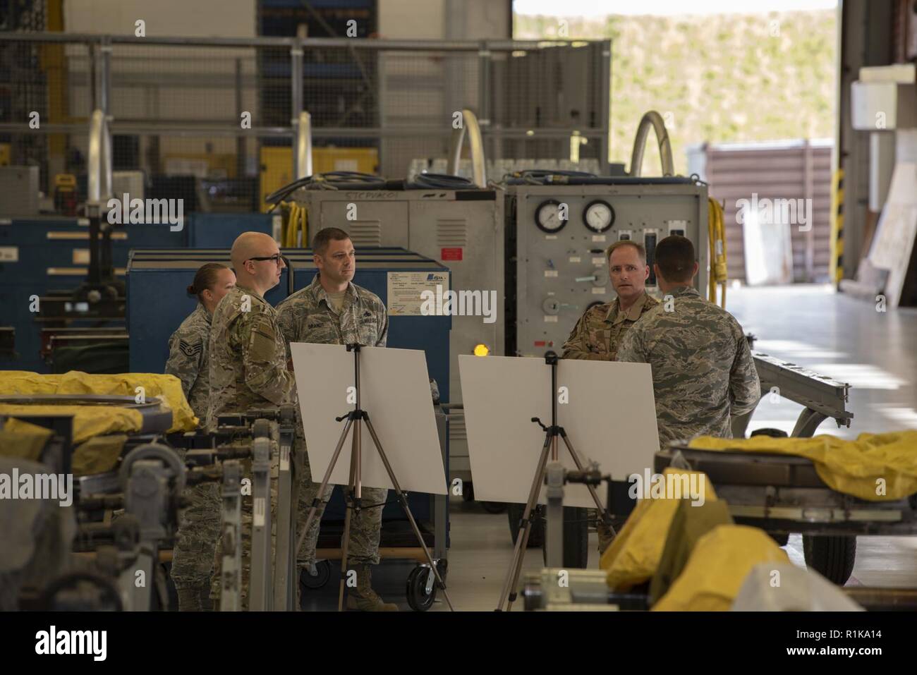 Maj. Gen. John Wood, Third Air Force commander, receives a brief from ...
