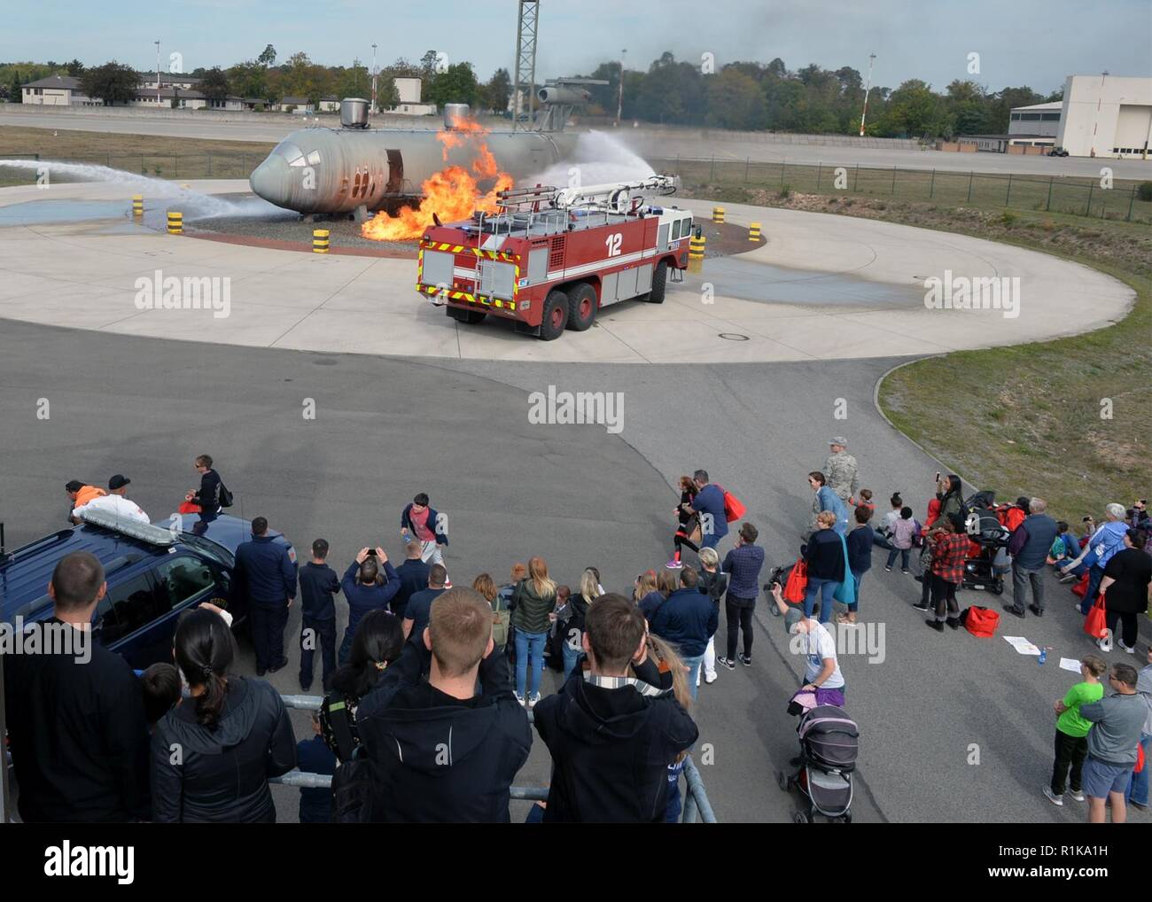 Attendees watch as firefighters assigned to the 86th Civil Engineer ...