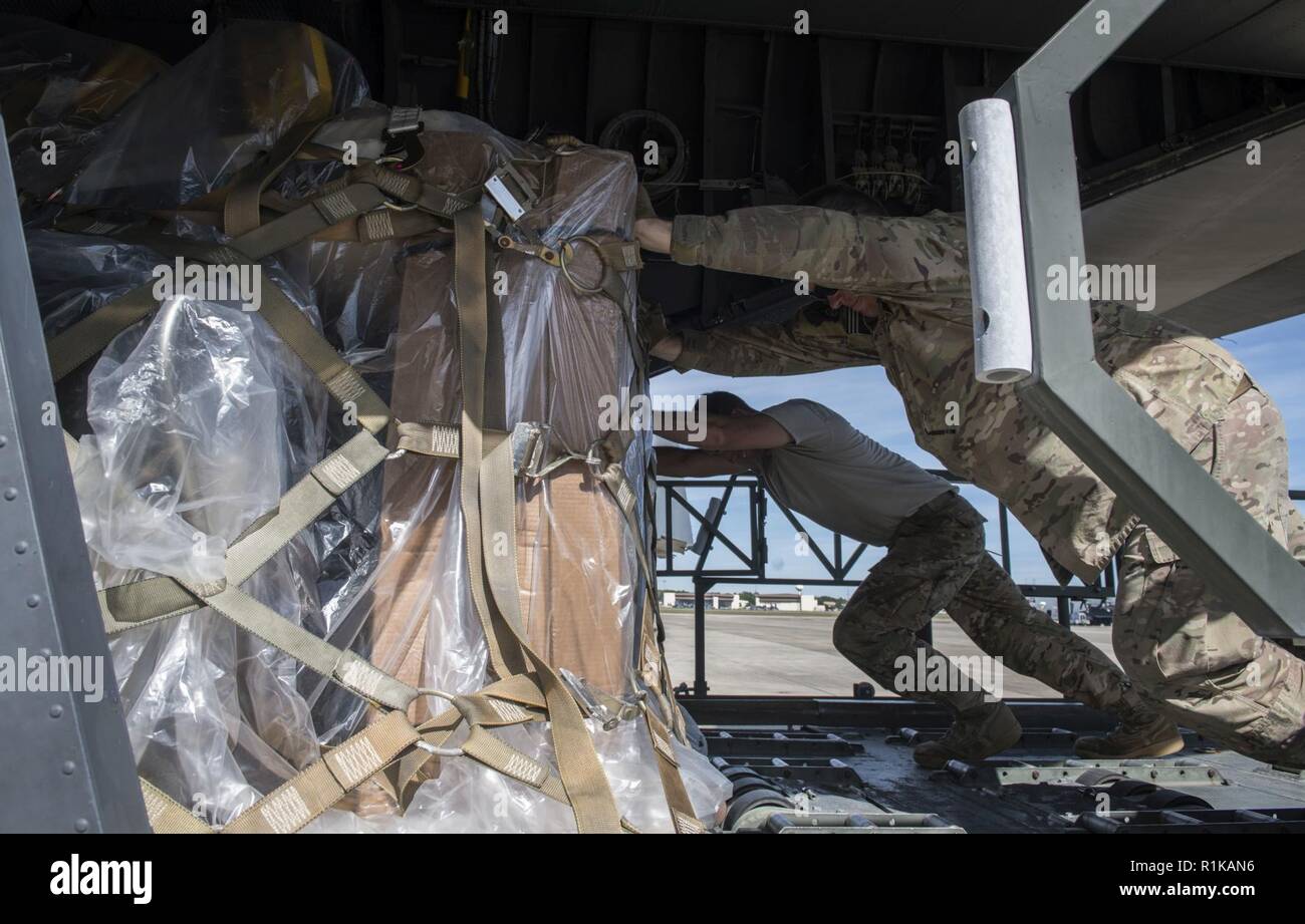 Aircrew members with the 15th Special Operations Squadron load cargo ...