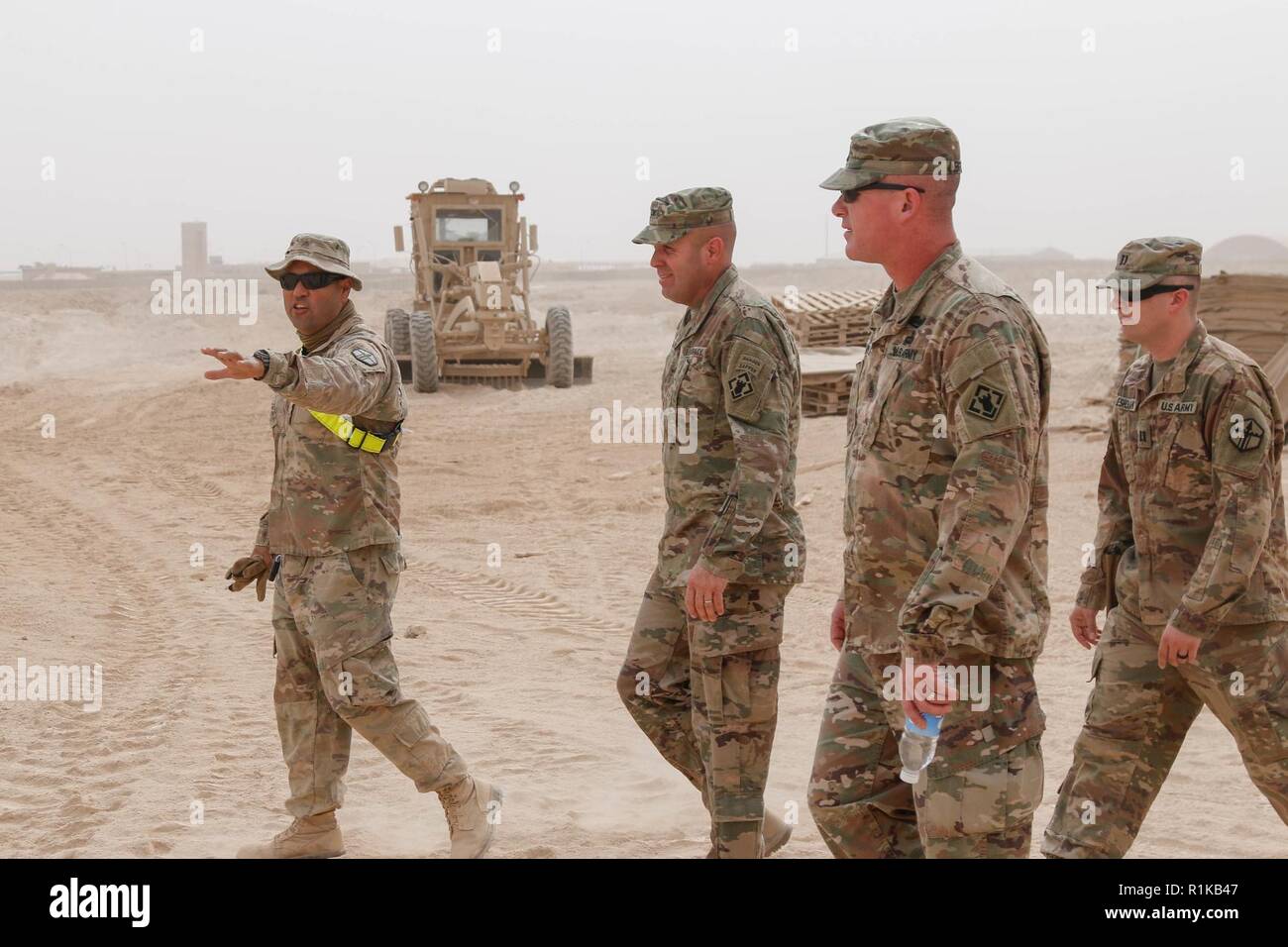 U.S. Army Sgt. Armando Lopez, left, assigned to 387th Engineer Company ...