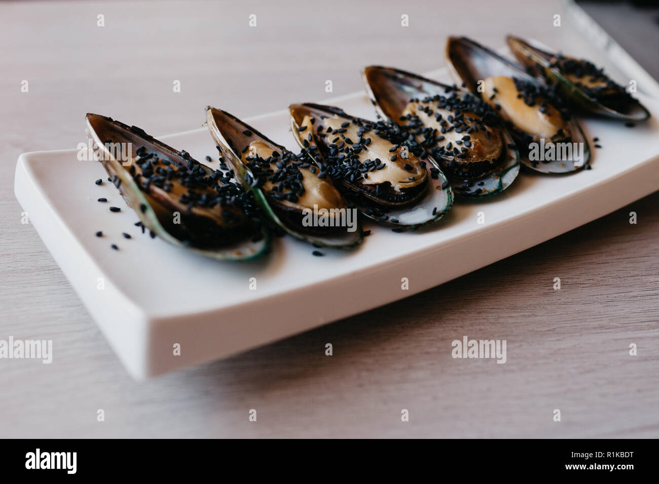 Grilled mussel on frying pan hi-res stock photography and images - Alamy