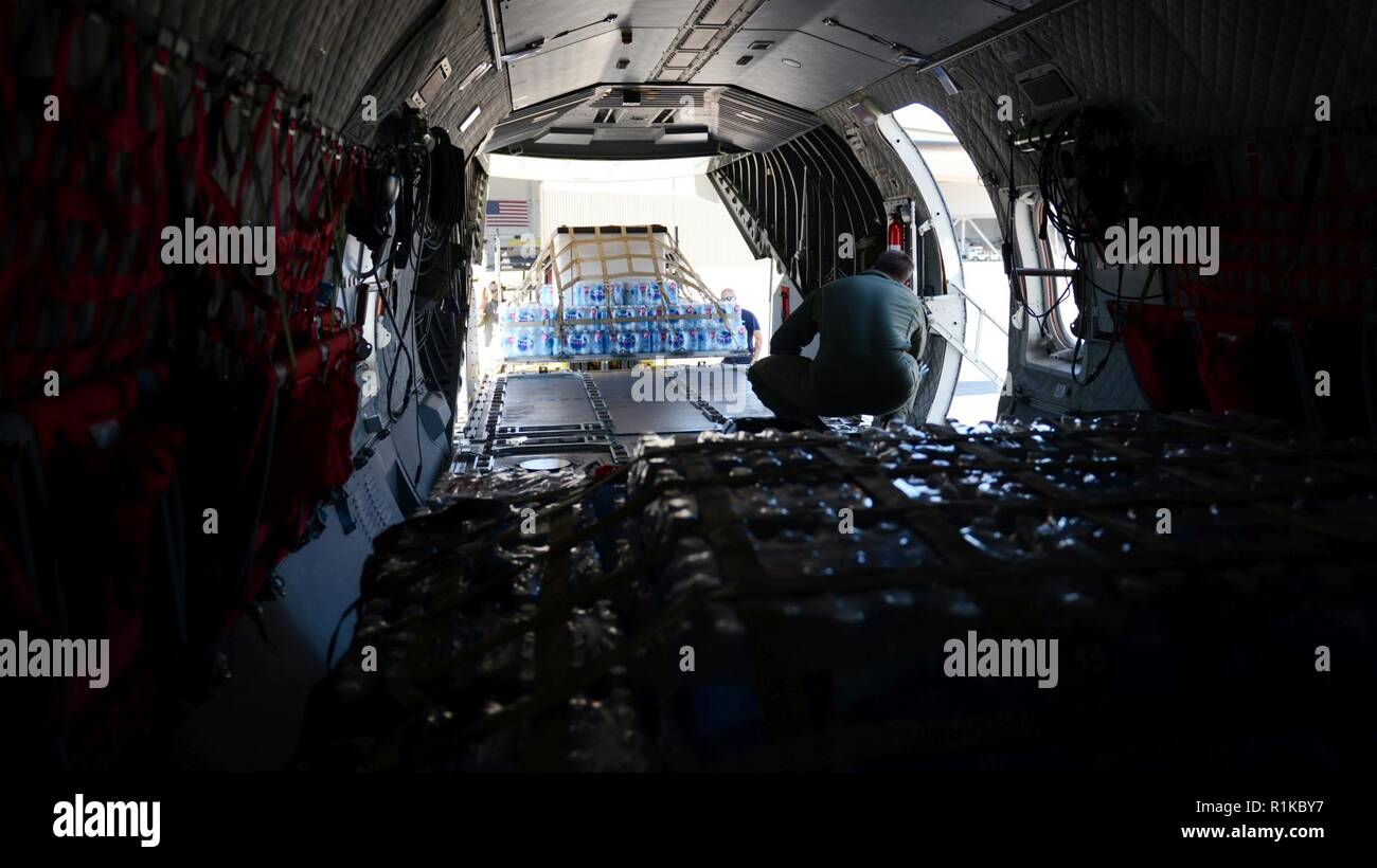 Crew members from Air Station Corpus Christi load an HC-144 Ocean ...