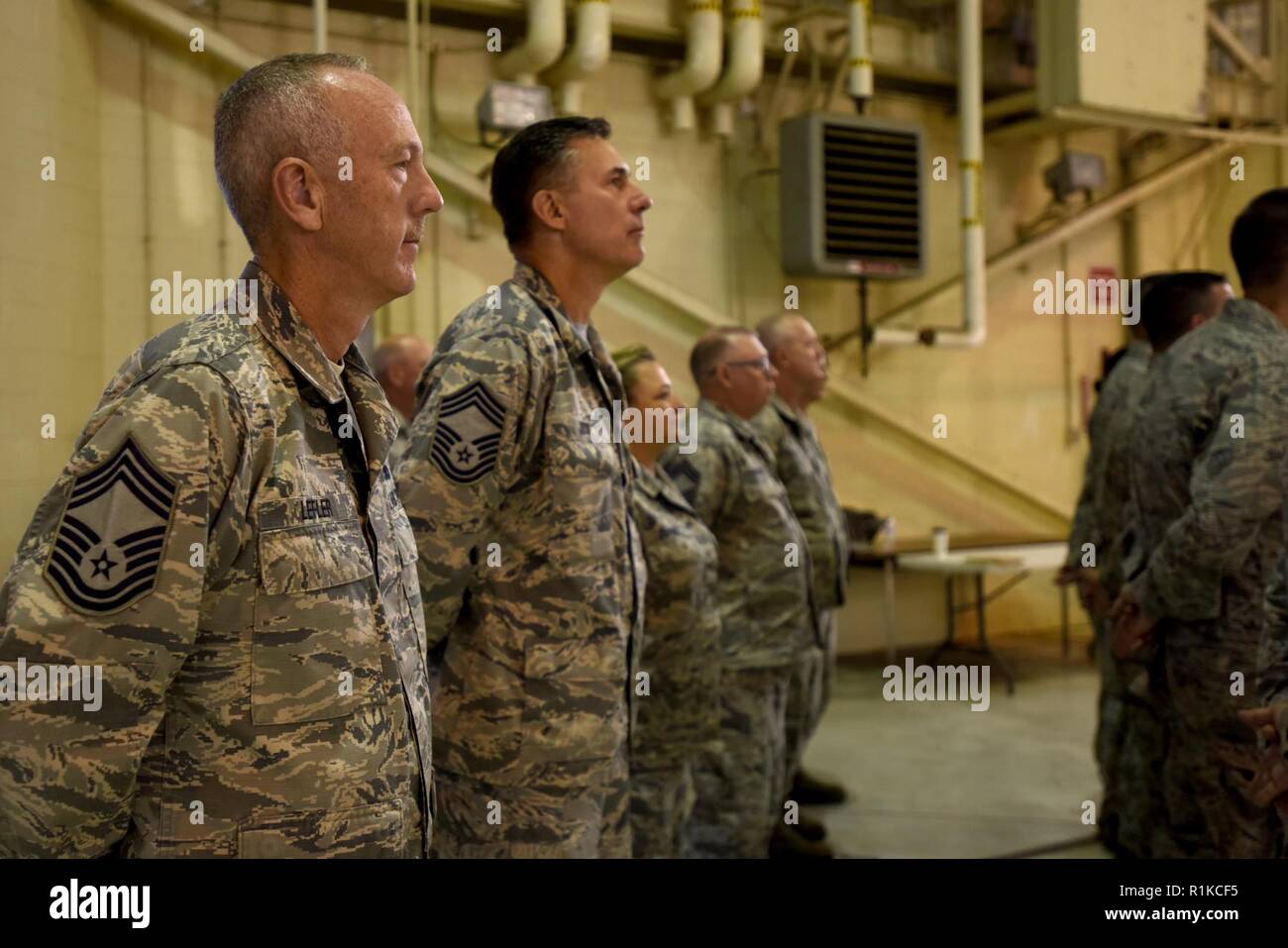 U.S. Air Force Chief Master Sgts. stand ready before a promotion ...
