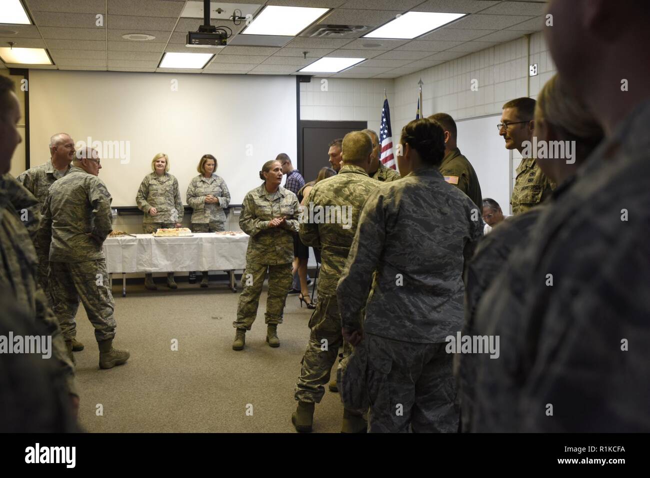 U.S. Air Force Chief Master Sgt. Lisa Phillips (center) is ...