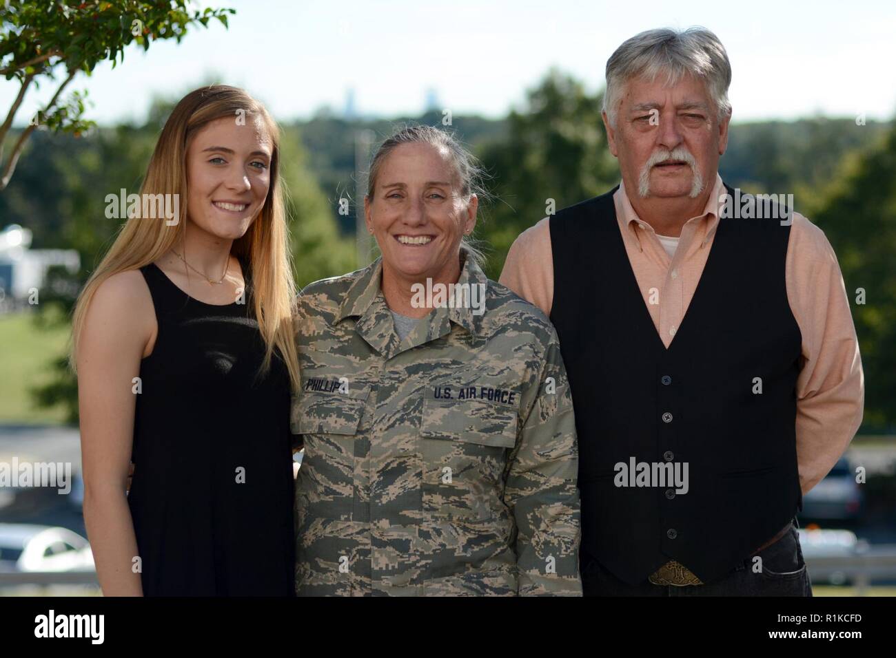 U.S. Air Force Chief Master Sgt. Lisa Phillips (center) poses for ...