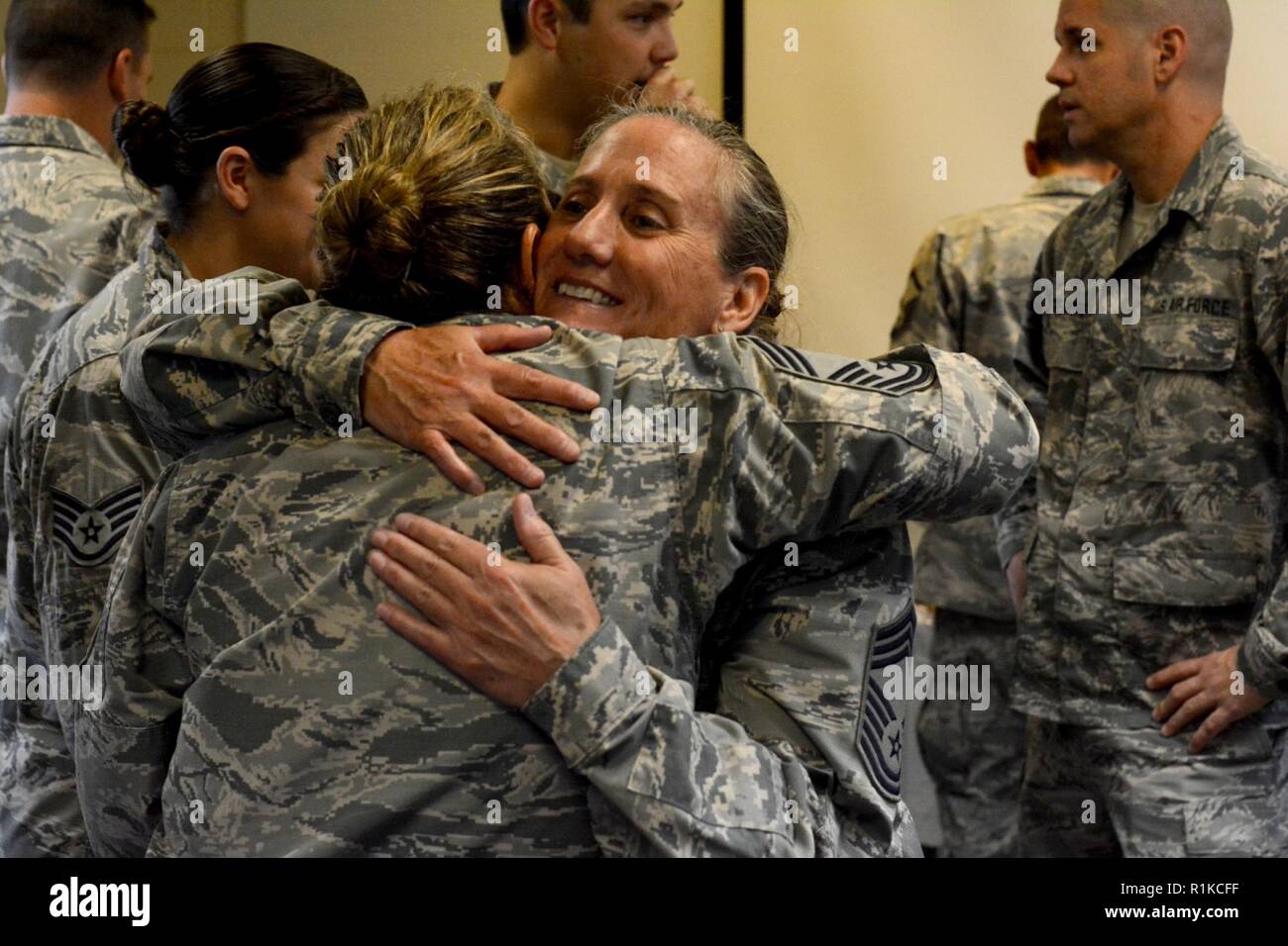 U.S. Air Force Chief Master Sgt. Lisa Phillips is hugged and ...