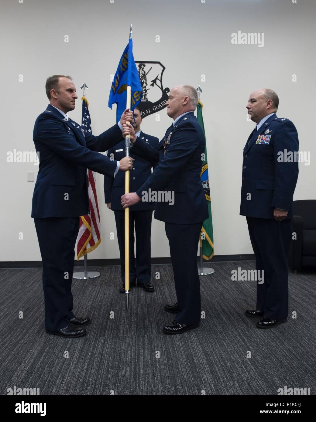 Col. Johan Deutscher, 141st Air Refueling Wing commander, accepts the ...