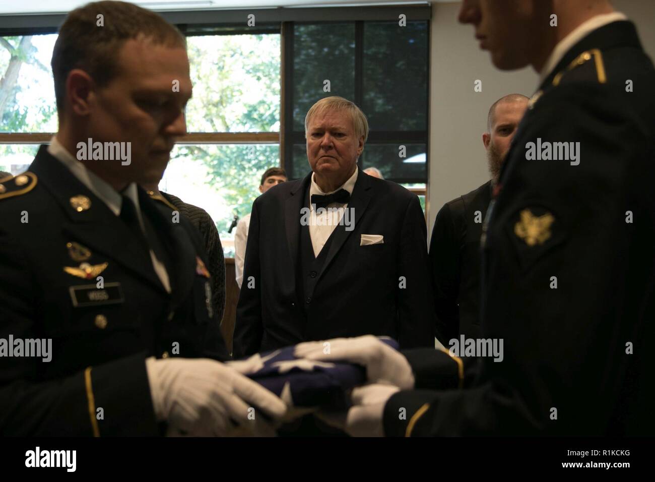 Lt. Col. (Ret.) Bill Cook observes Staff Sgt. Samuel Voss, Spc. Jared ...
