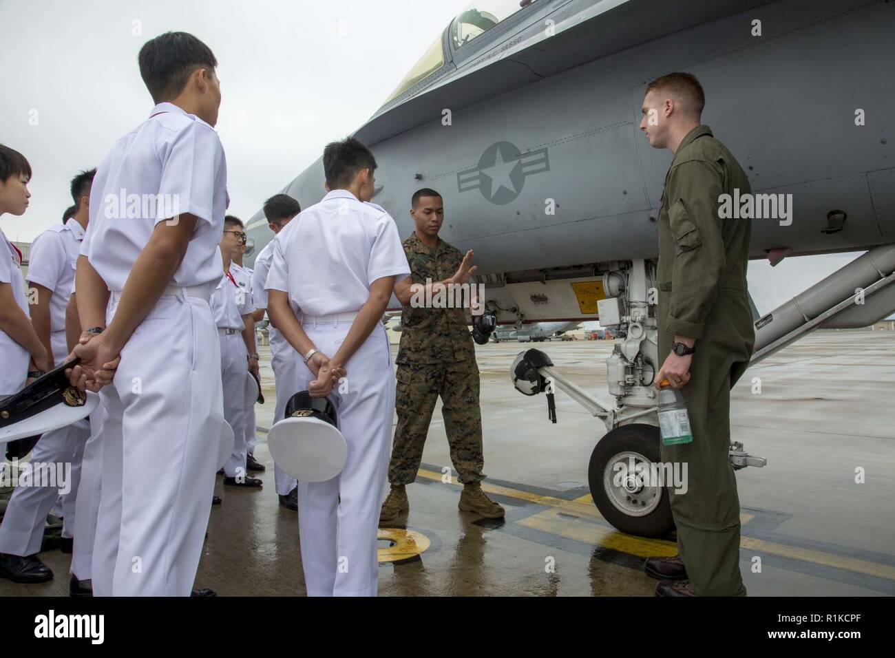 U.S. Marine Sgt. Mark Miller, center, an administration specialist, and ...