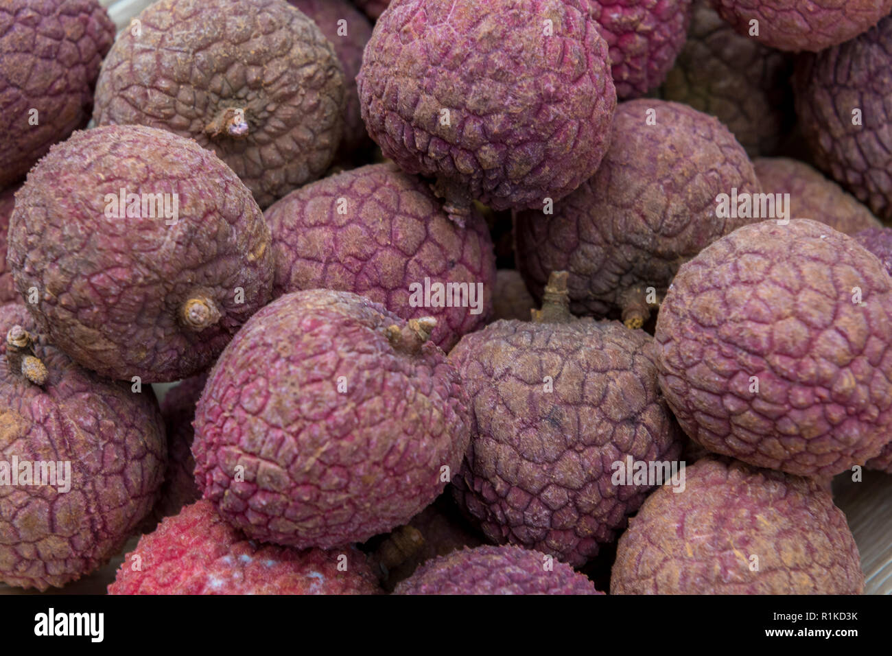 lychees for sale on a market stall. close up of lychee fruits Stock ...