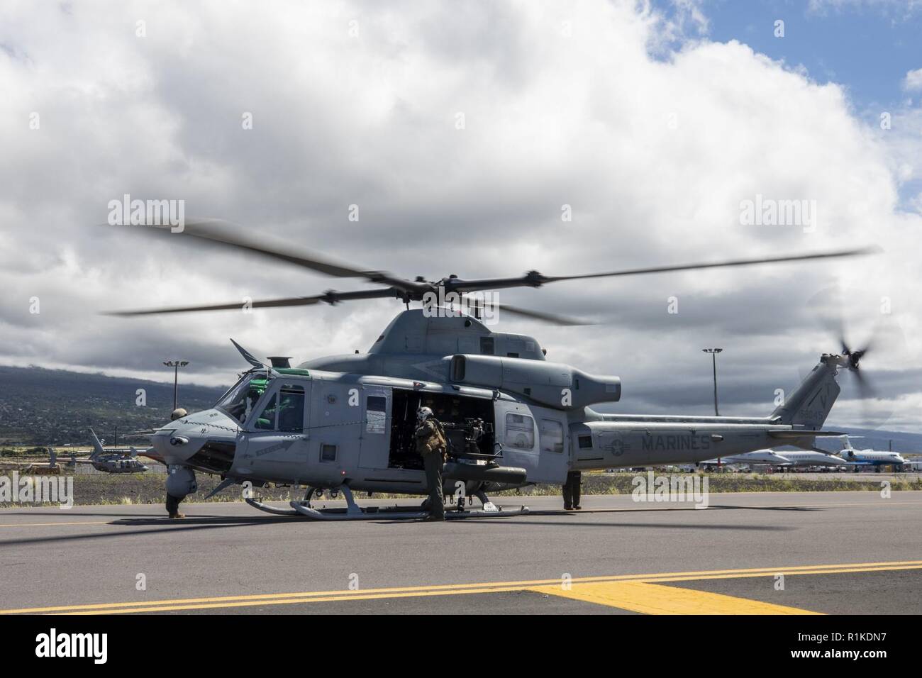 U.S. Marine Corps crew chiefs with Marine Light Attack Helicopter ...