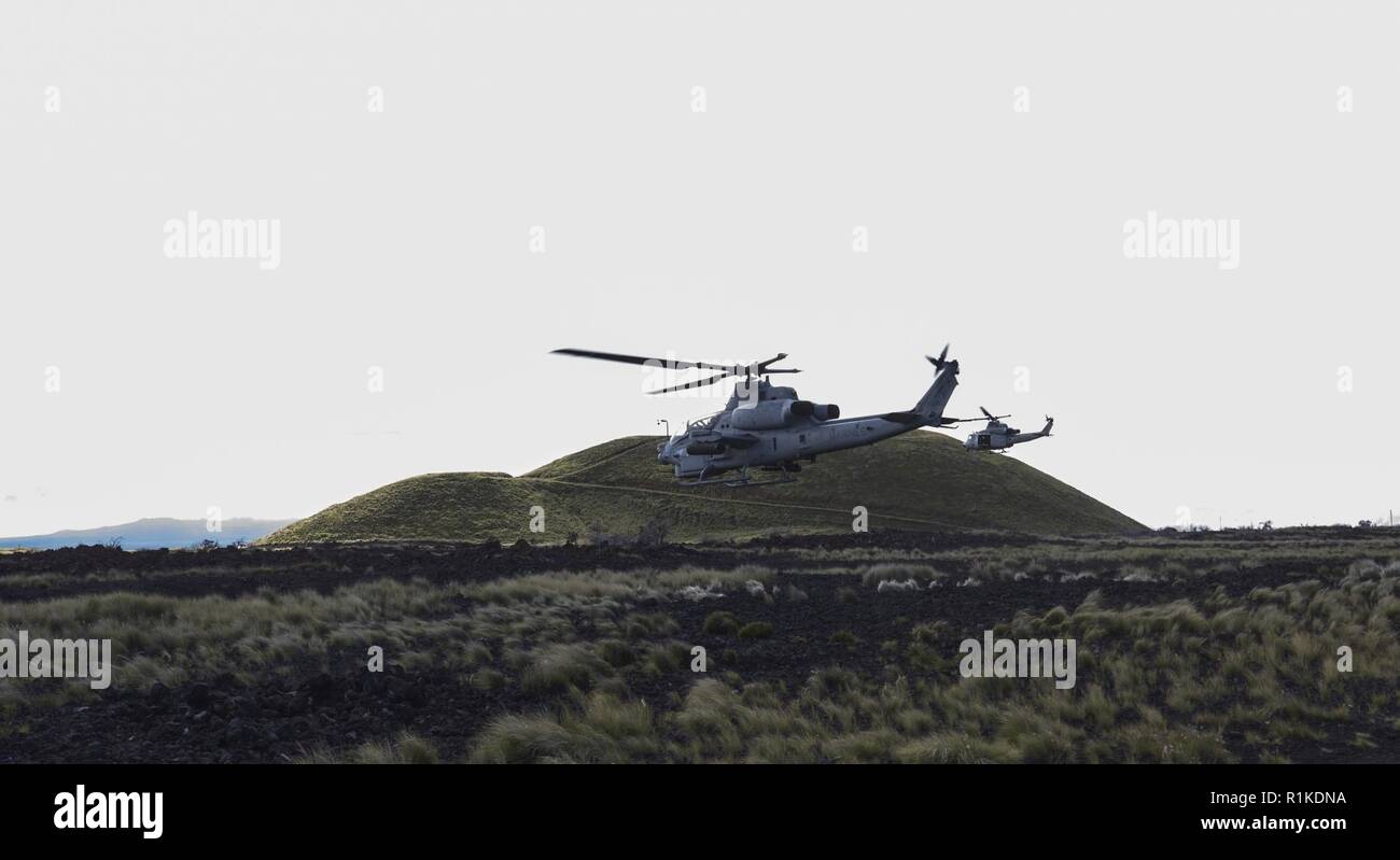 A UH-1Y Venom helicopter and AH-1Z Viper attack helicopter assigned to ...