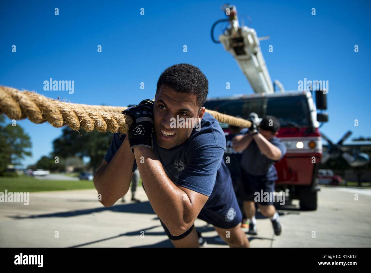 Participants pulls a firetruck during the National Fire Prevention Week ...