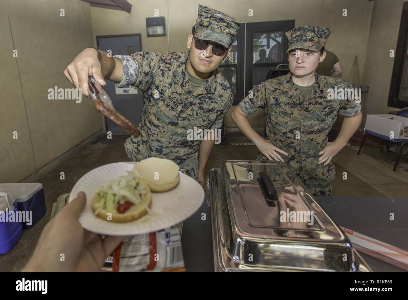 U.S. Marine Corps Pfc. Jose Arenas and Cpl. Alicia Frost, Headquarters ...