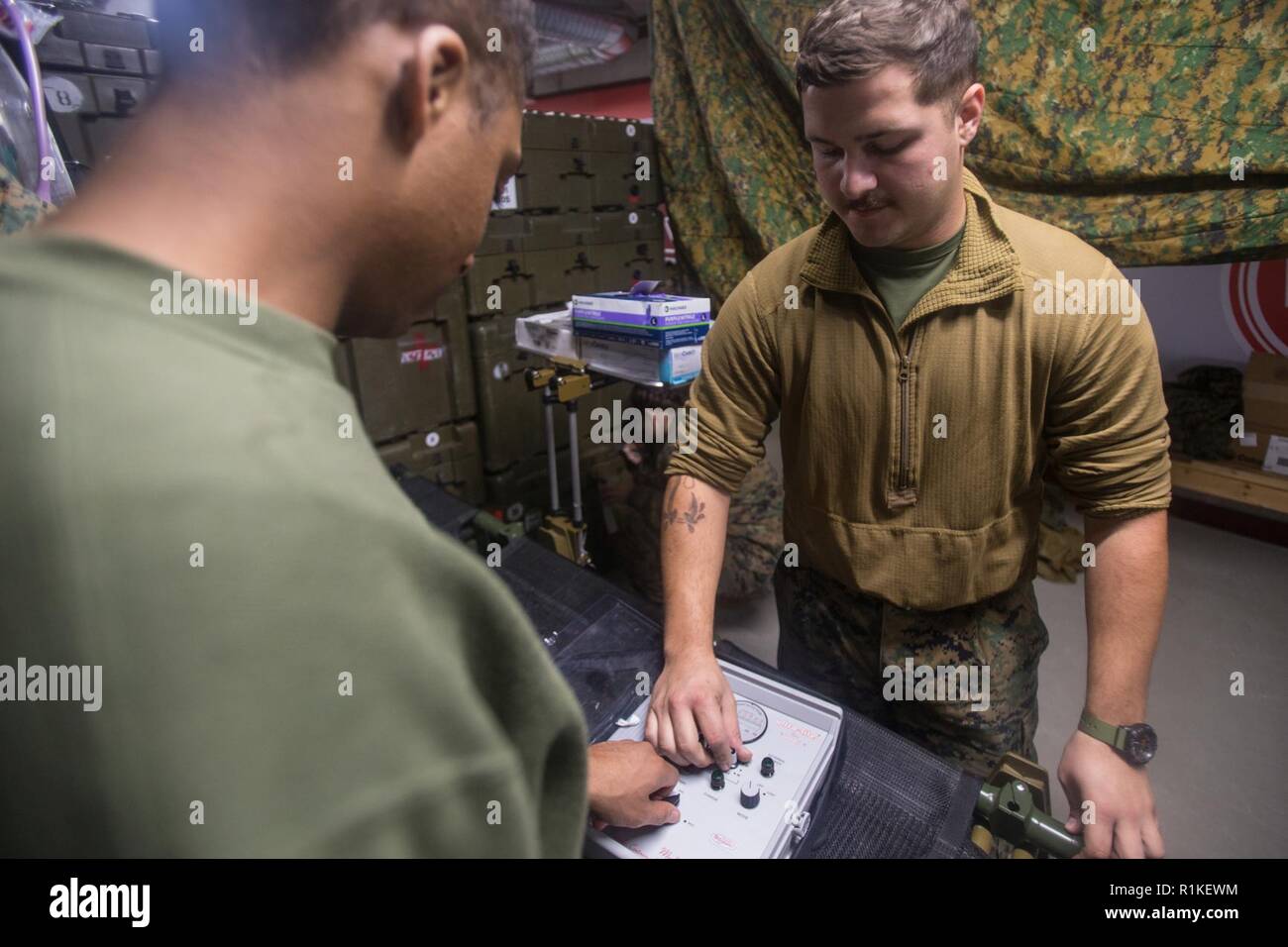U.S. Navy Hospitalman Devin Wilson, left and Hospital Corpsman 2nd ...