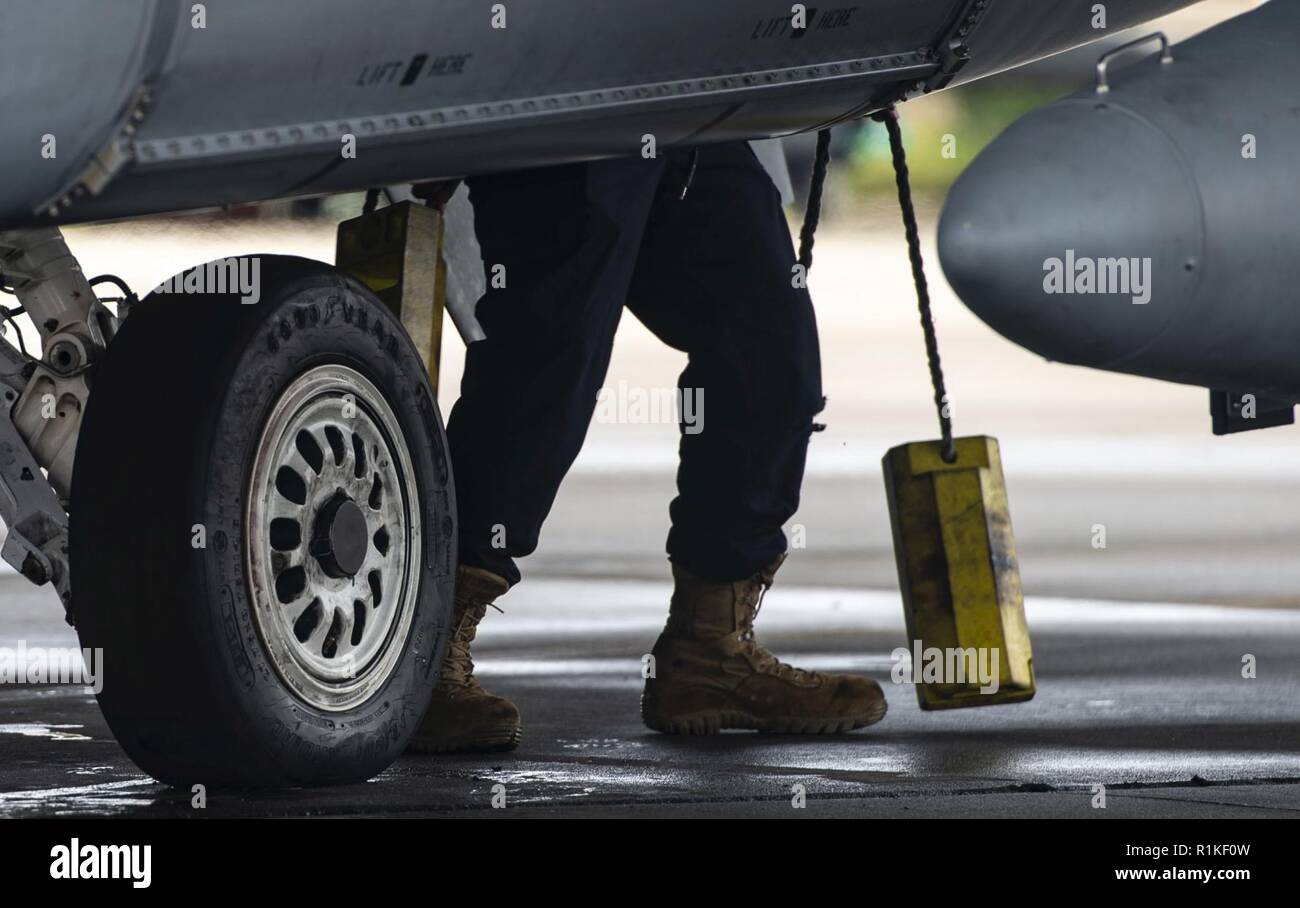 A U.S. Air Force tactical aircraft maintainer removes chalks from an F ...