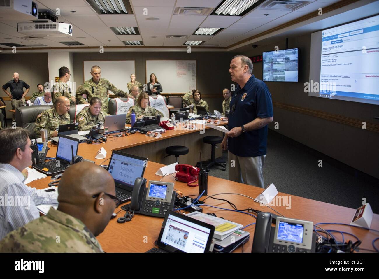 Steven Burton, emergency management specialists, briefs members of the ...